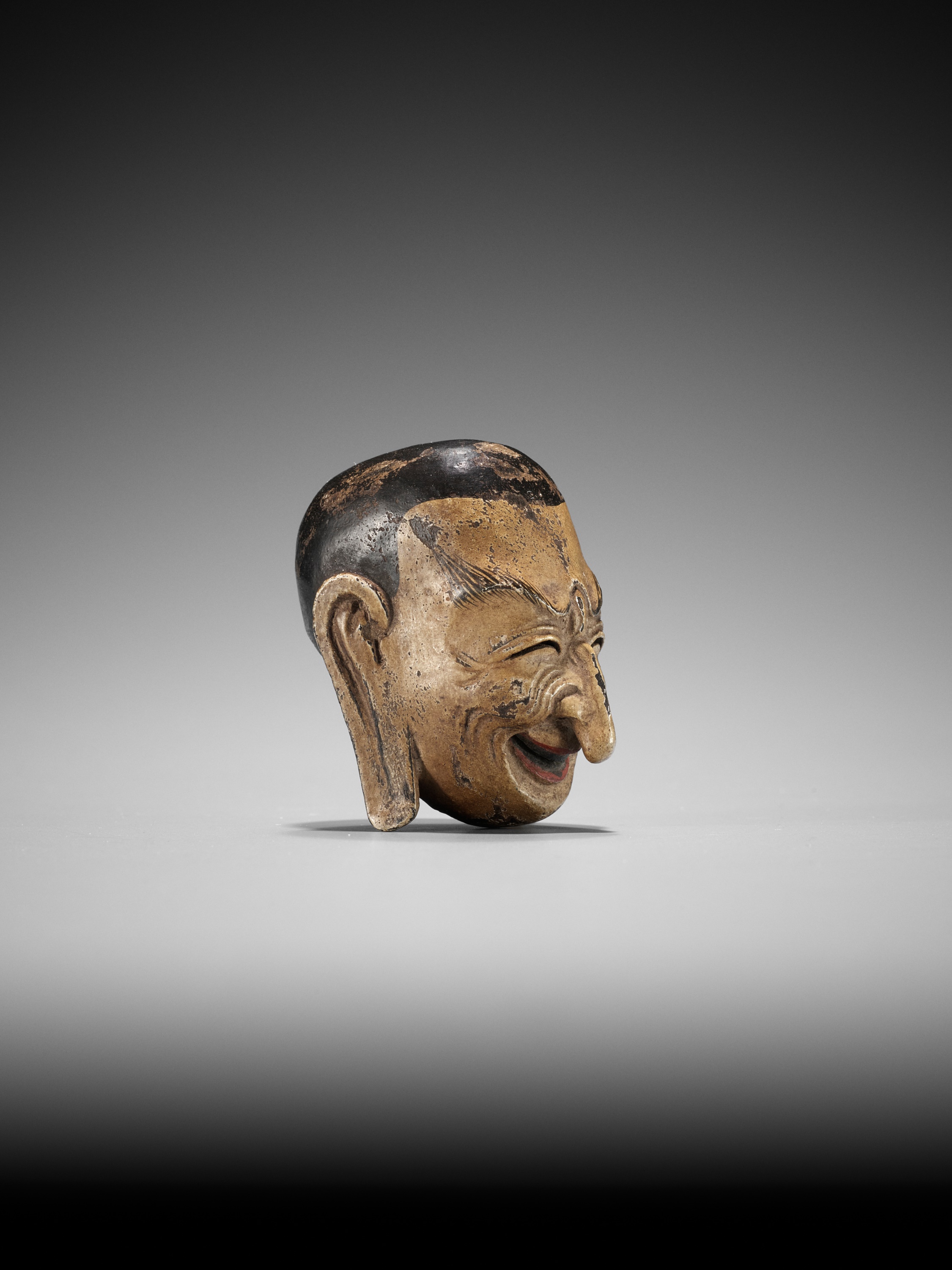 Lot 255 - TETSURO: A LACQUERED WOOD GIGAKU MASK
