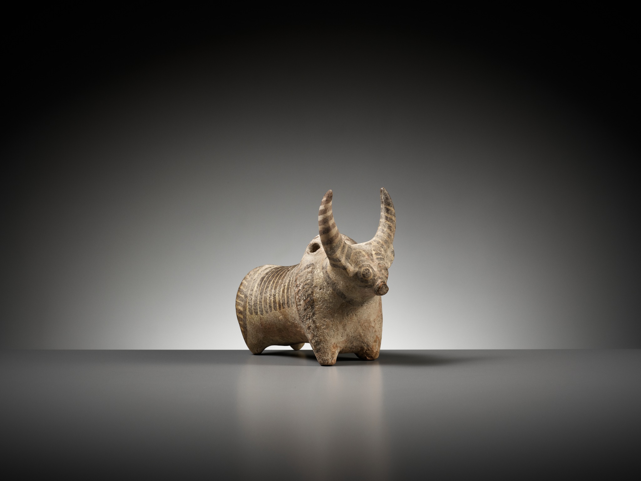 Lot 620 - A PAINTED TERRACOTTA FIGURE OF A ZEBU,