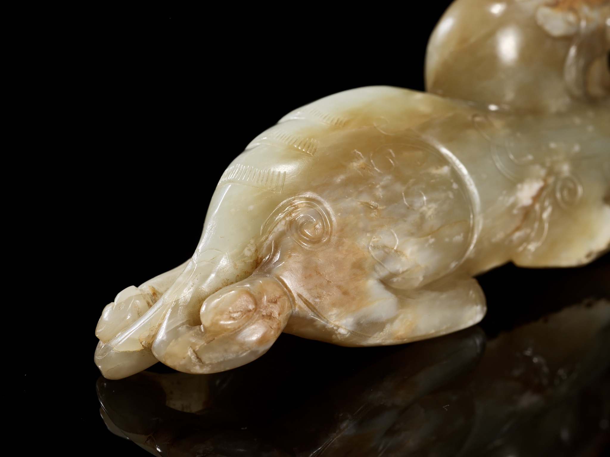 Lot 34 - A RARE, LARGE AND POWERFUL JADE FIGURE OF A