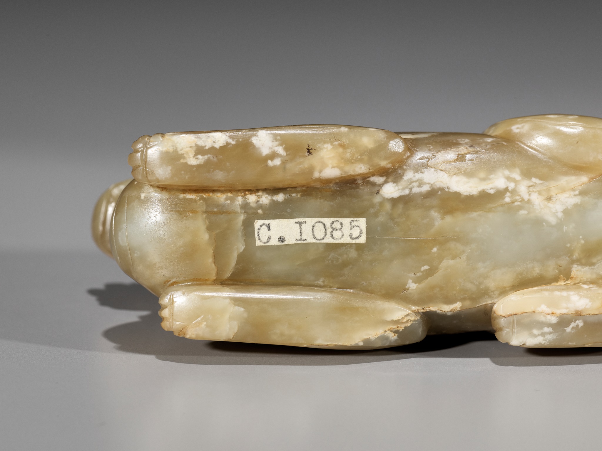 Lot 34 - A RARE, LARGE AND POWERFUL JADE FIGURE OF A
