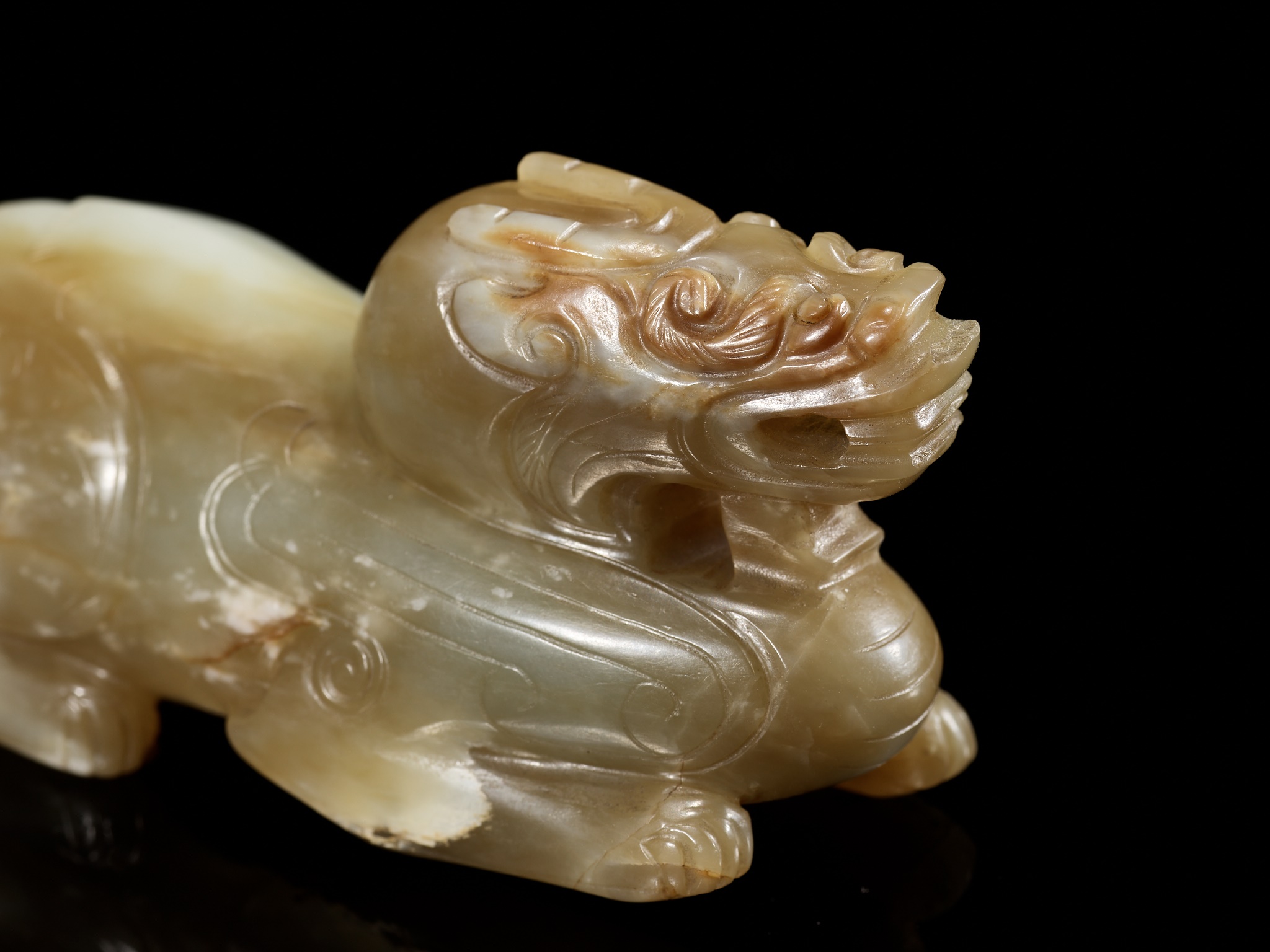 Lot 34 - A RARE, LARGE AND POWERFUL JADE FIGURE OF A