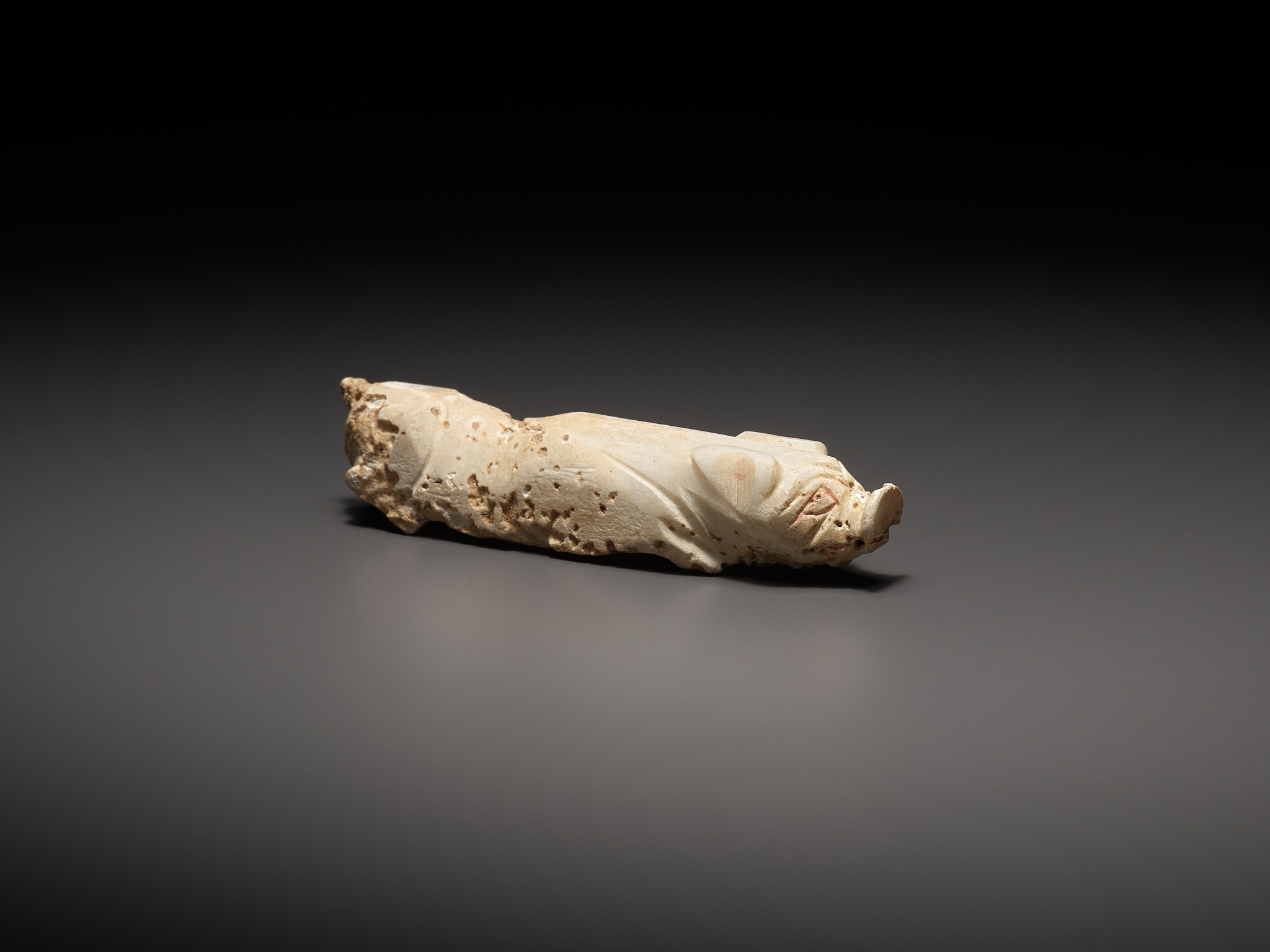 Lot 75 - A WHITE JADE FIGURE OF A PIG, HAN DYNASTY