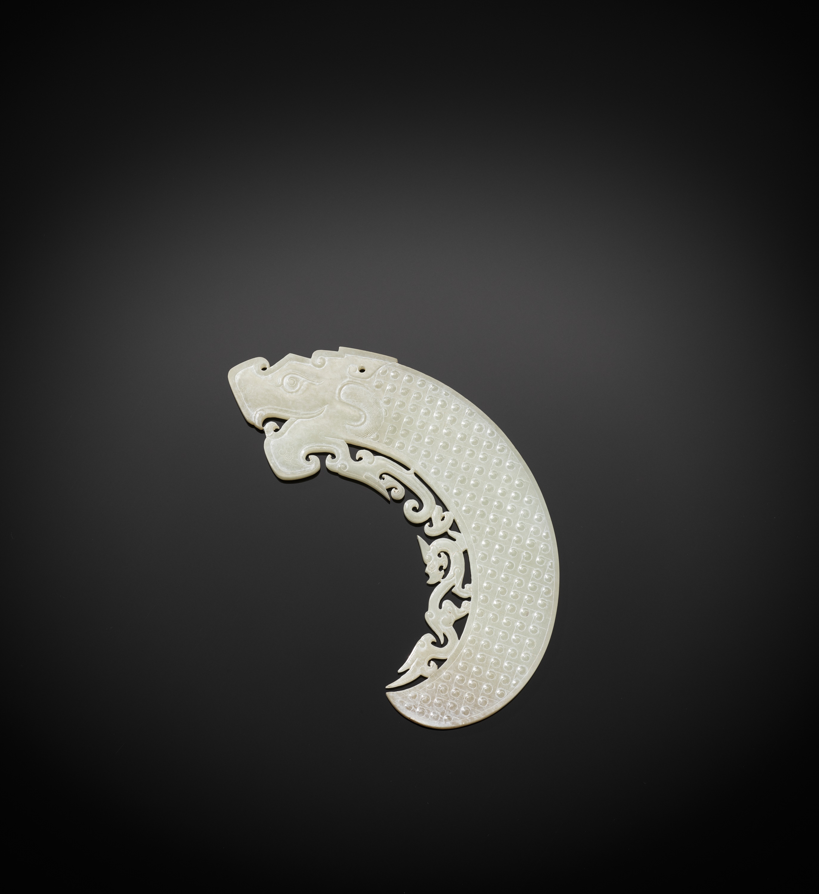 Lot 73 - A WHITE JADE ‘DRAGON’ ORNAMENT, WESTERN HAN