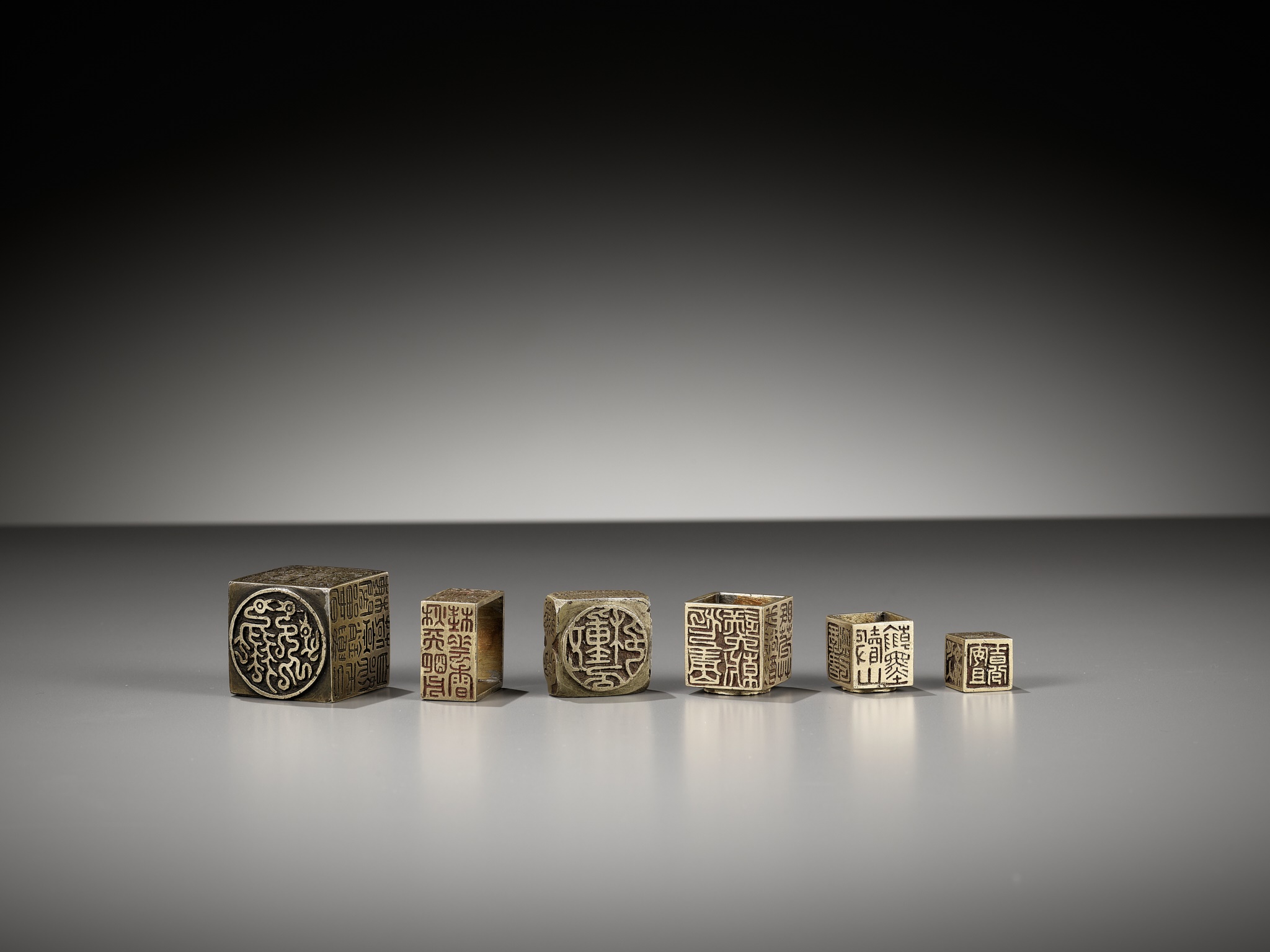 Lot 491 - A COMPLETE SET OF SIX BRONZE NESTING SEALS,