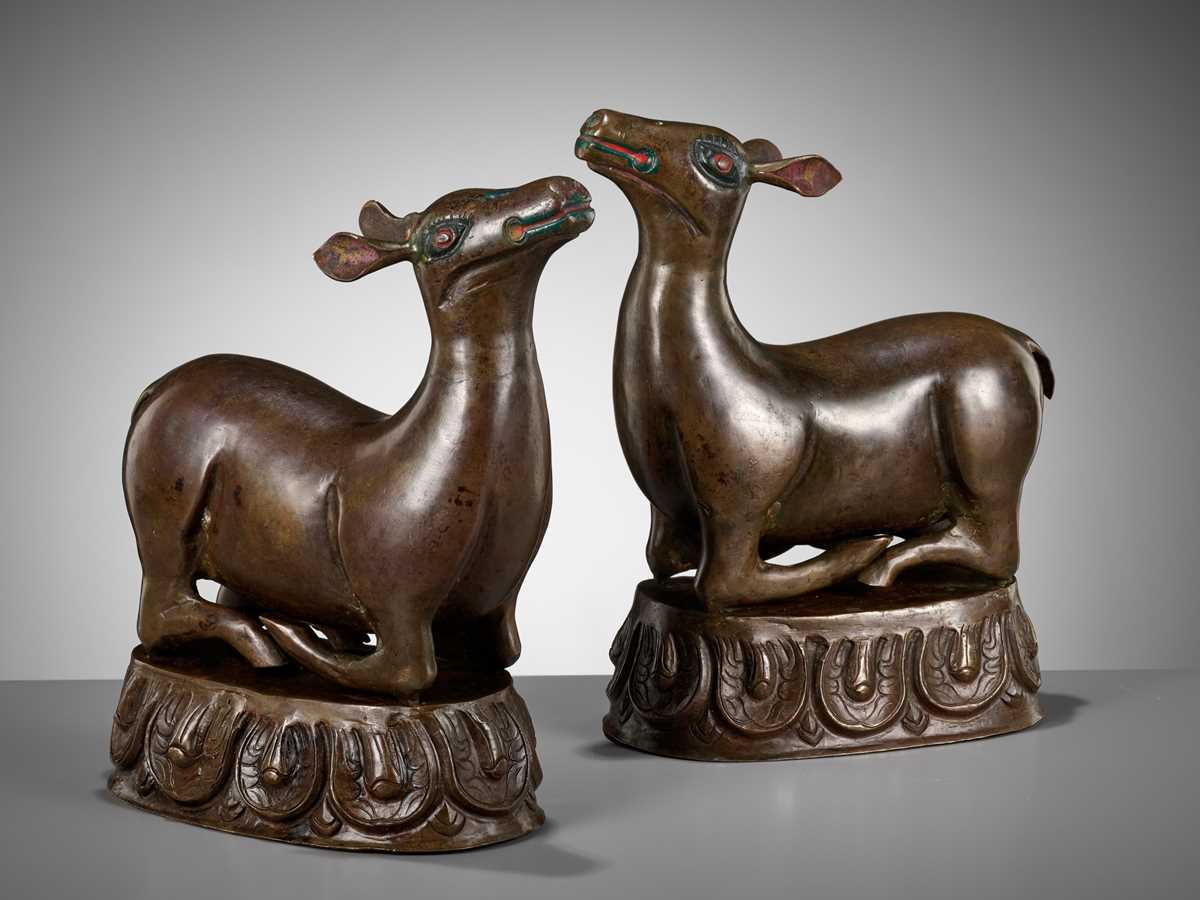 Lot 524 - A PAIR OF COPPER REPOUSSÉ FIGURES OF DEER,