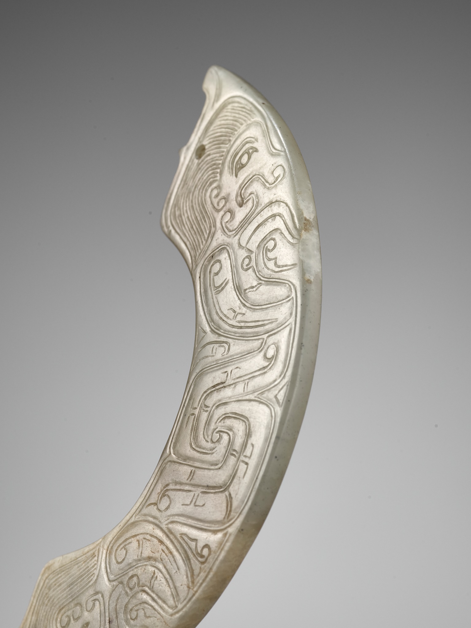 Lot 61 - A SMALL PALE CELADON JADE ‘HUMAN FIGURE’