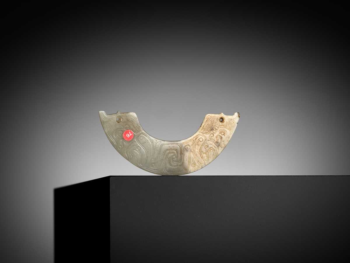 Lot 61 - A SMALL PALE CELADON JADE ‘HUMAN FIGURE’