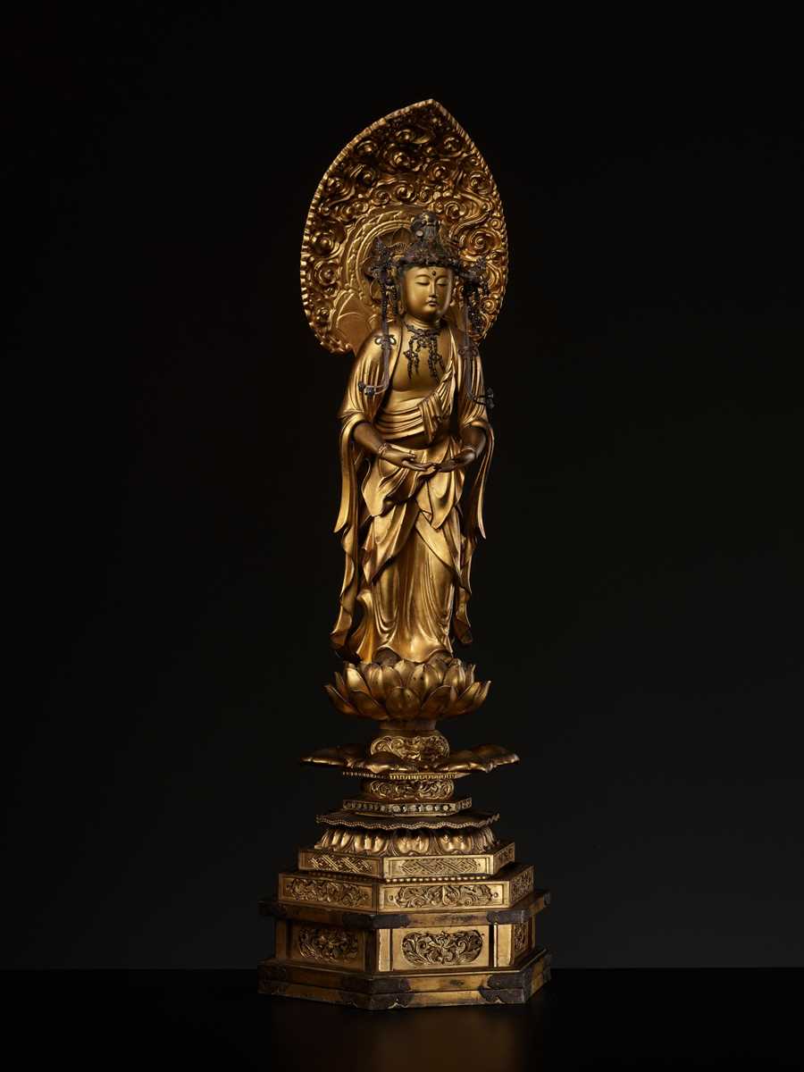 Lot 60 - A GILT WOOD FIGURE OF KANNON BOSATSU