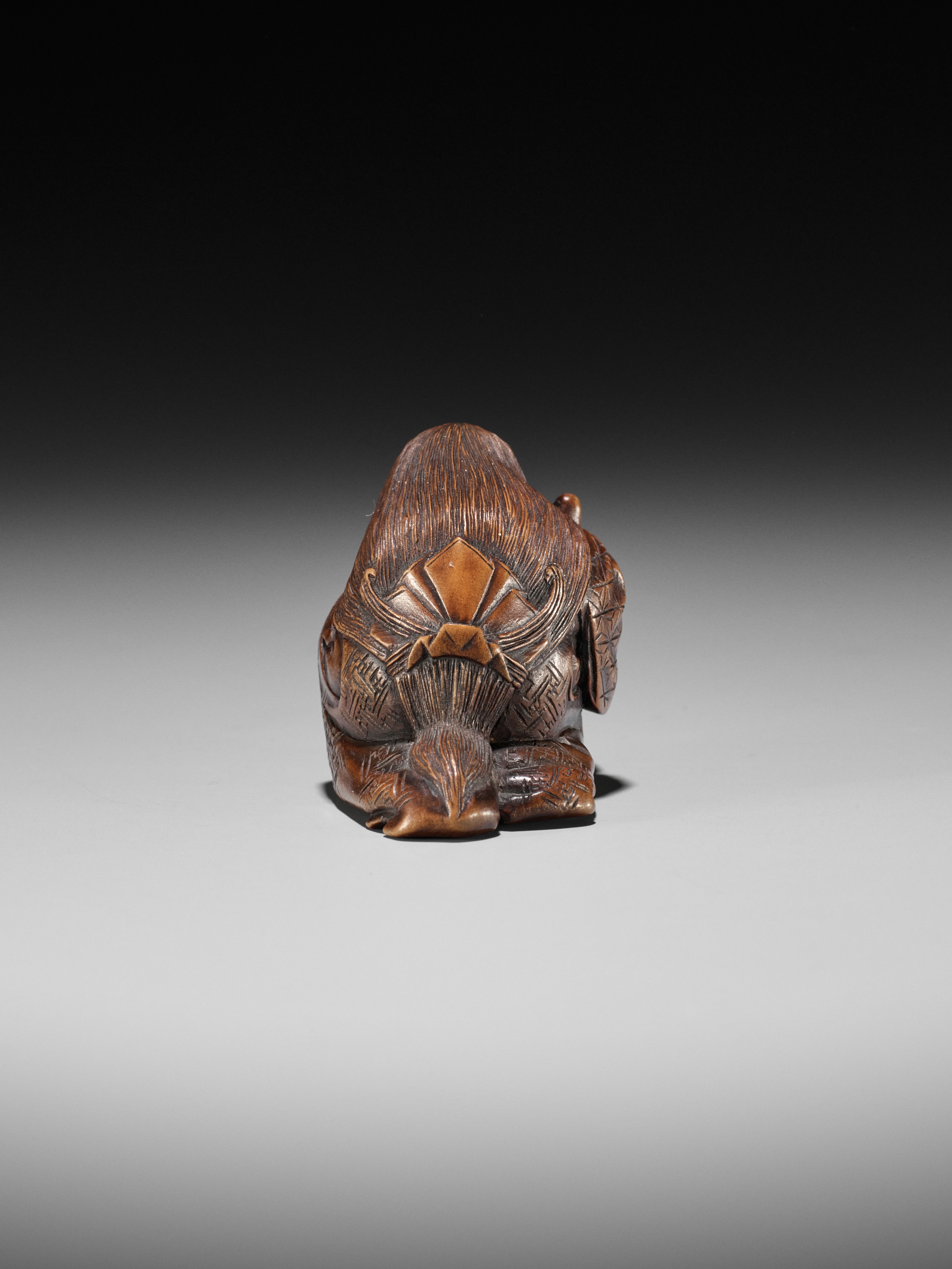 Lot 116 - NOBUKAZU: A WOOD SHUNGA NETSUKE OF OKAME
