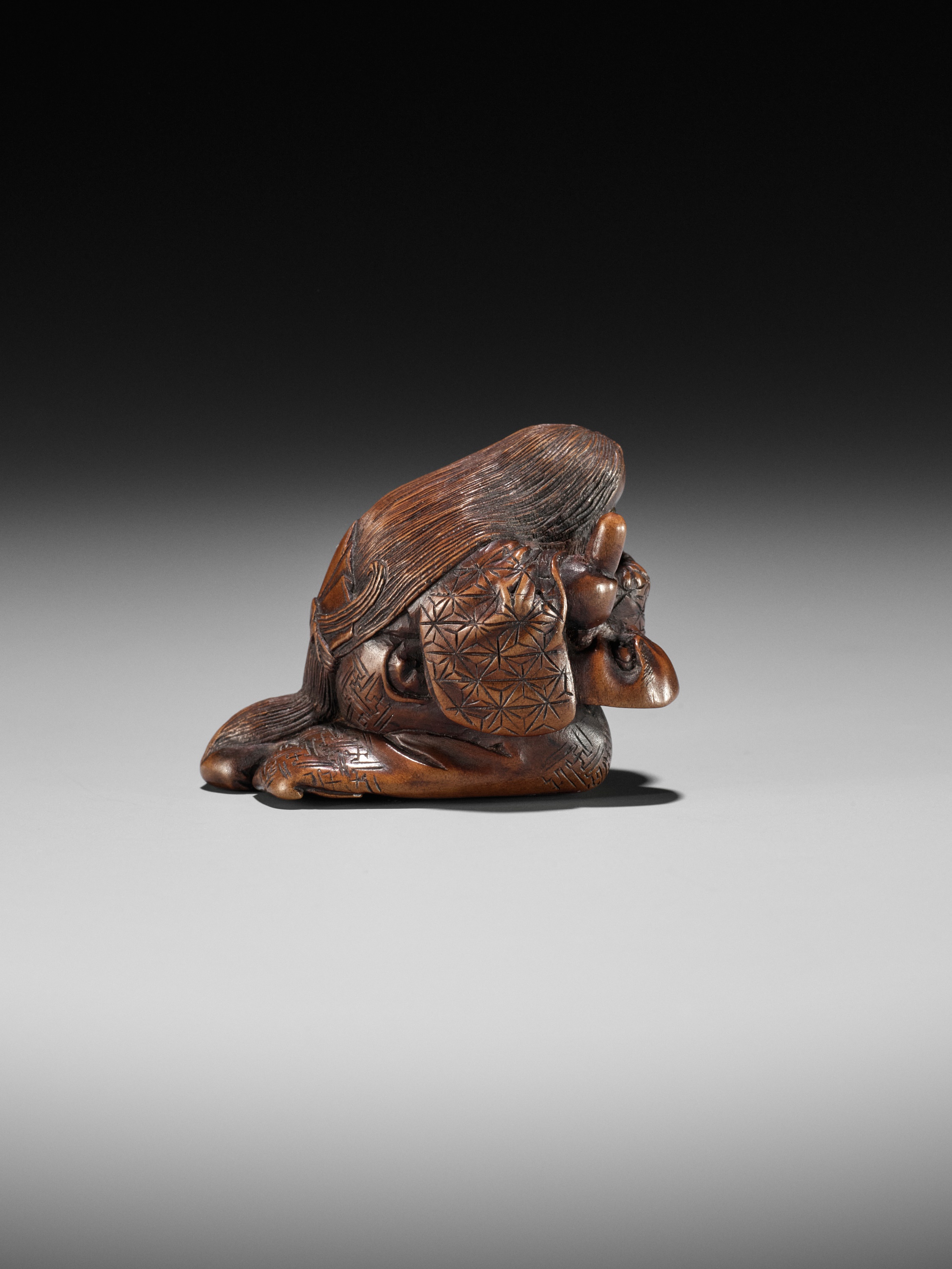 Lot 116 - NOBUKAZU: A WOOD SHUNGA NETSUKE OF OKAME