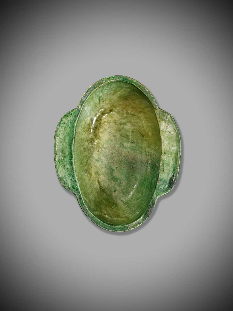 Lot 438 - A GREEN-GLAZED POTTERY EAR CUP, HAN DYNASTY