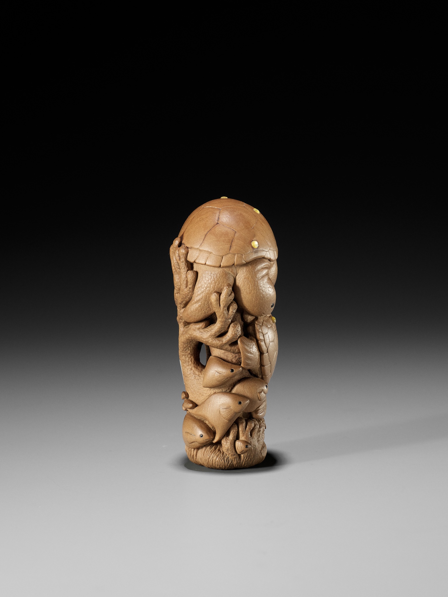 Lot 312 - DOUG MARSDEN: AN INLAID WOOD NETSUKE OF