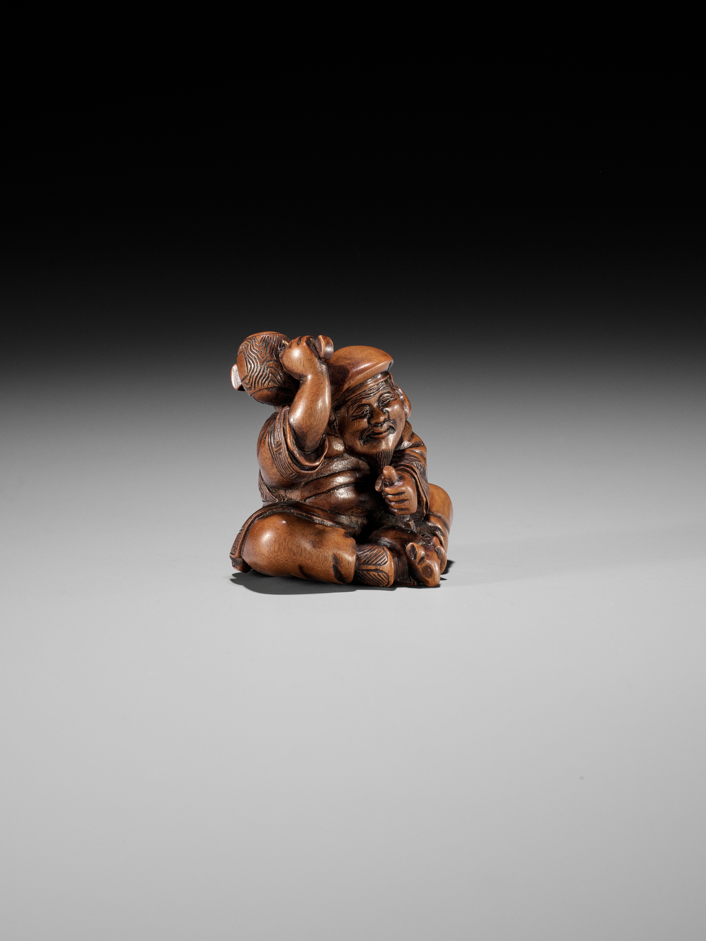 Lot 124 - MASANAO: A RARE WOOD NETSUKE OF DAIKOKU