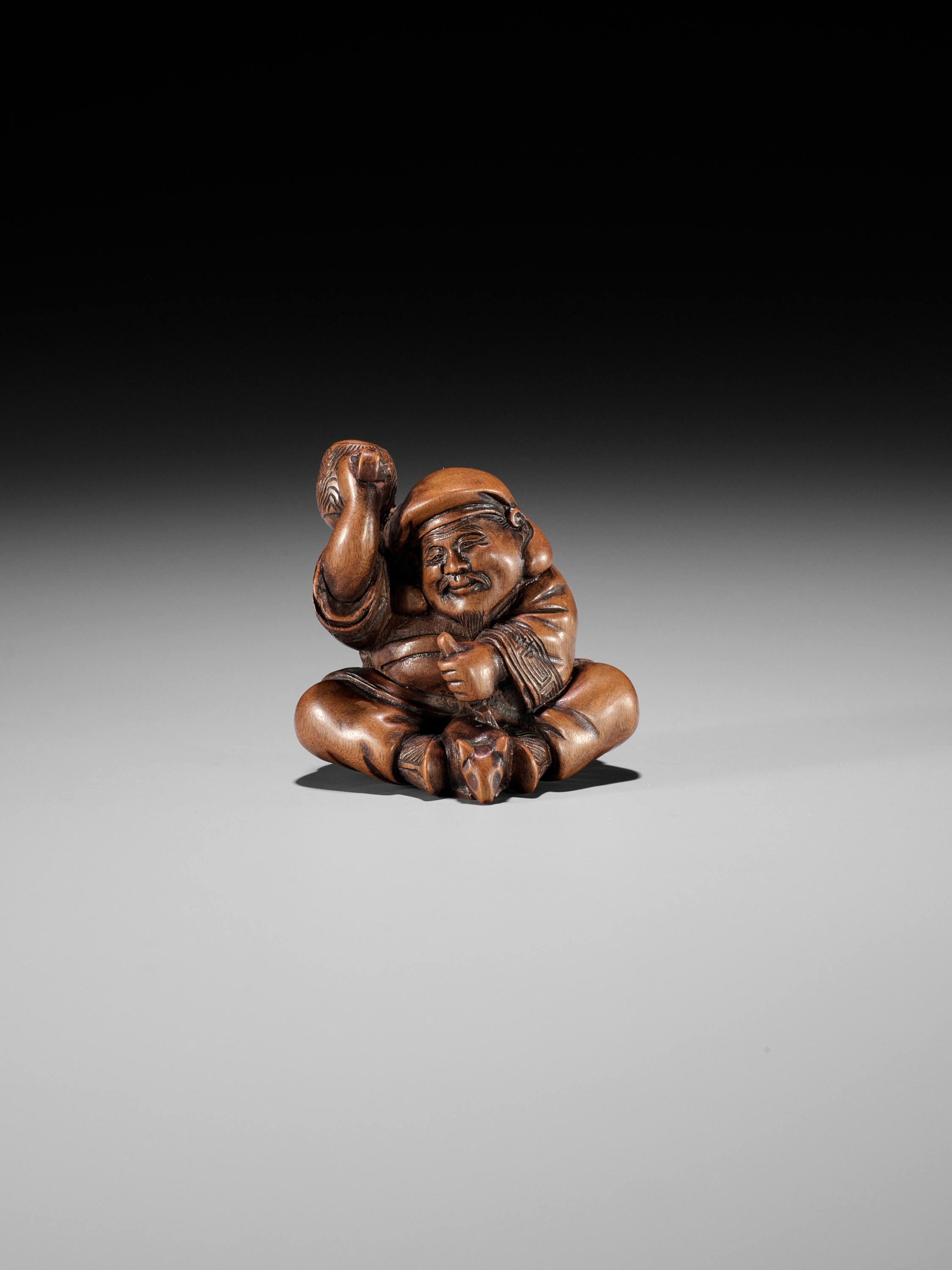 Lot 124 - MASANAO: A RARE WOOD NETSUKE OF DAIKOKU