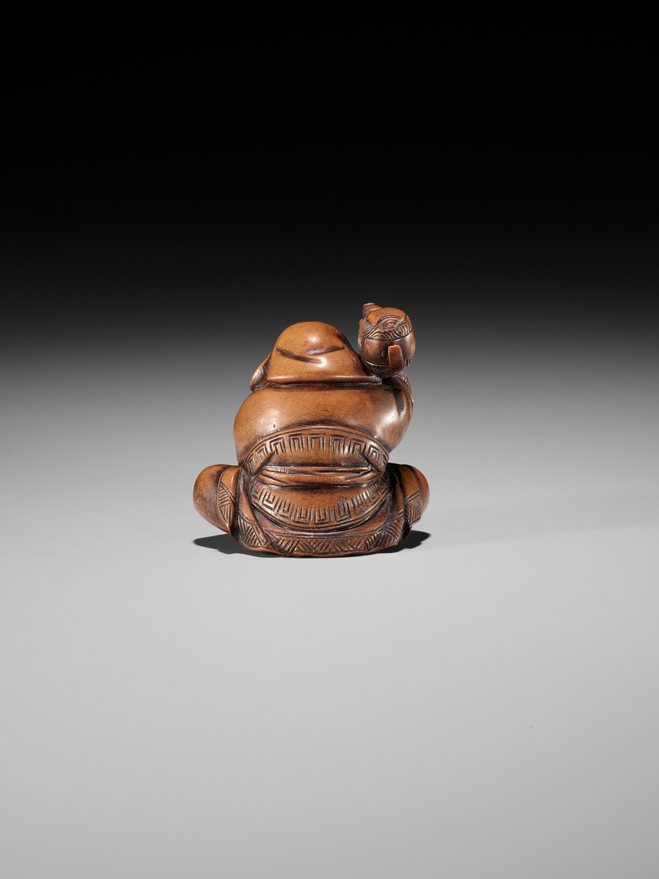 Lot 124 - MASANAO: A RARE WOOD NETSUKE OF DAIKOKU