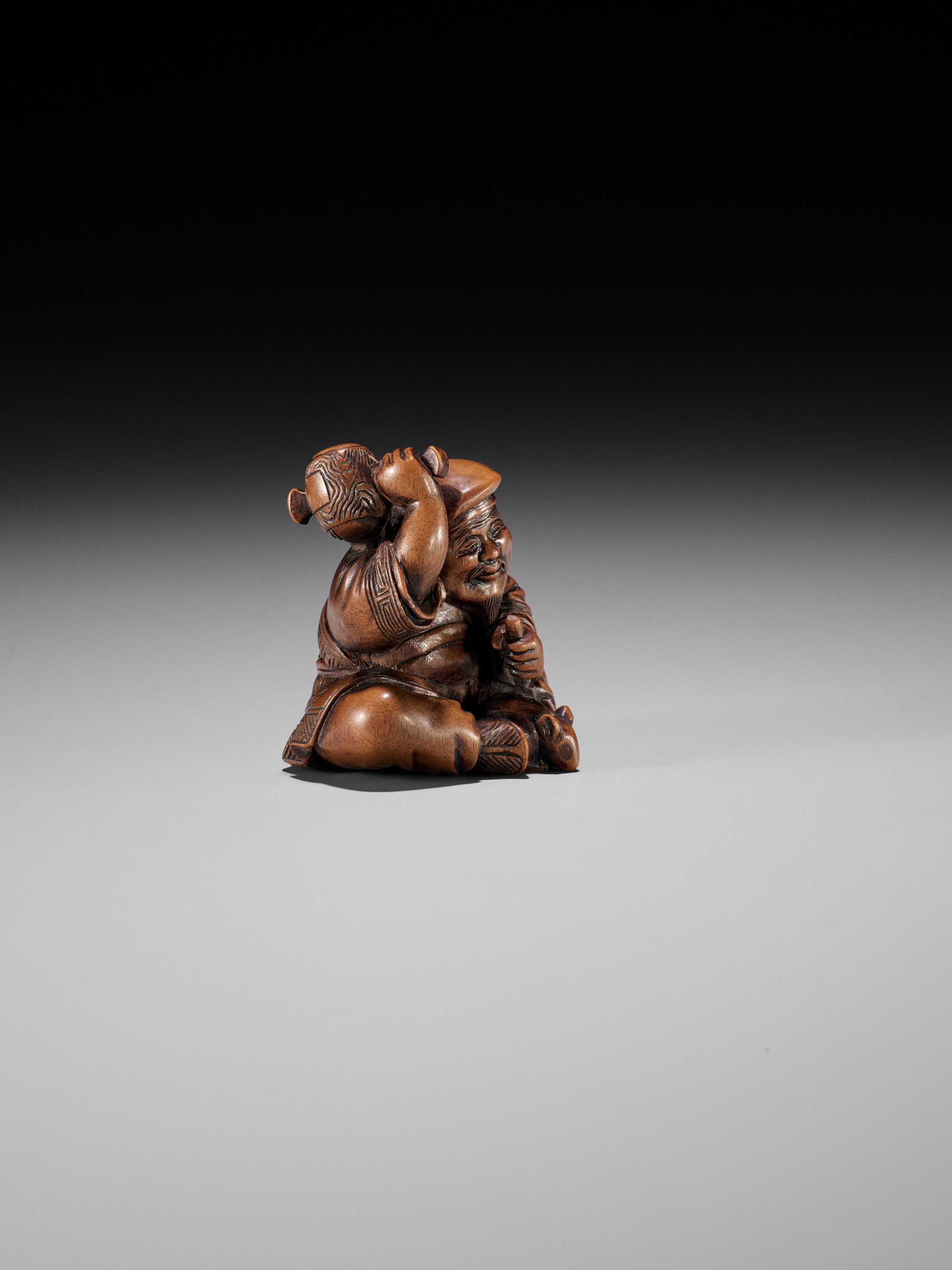 Lot 124 - MASANAO: A RARE WOOD NETSUKE OF DAIKOKU