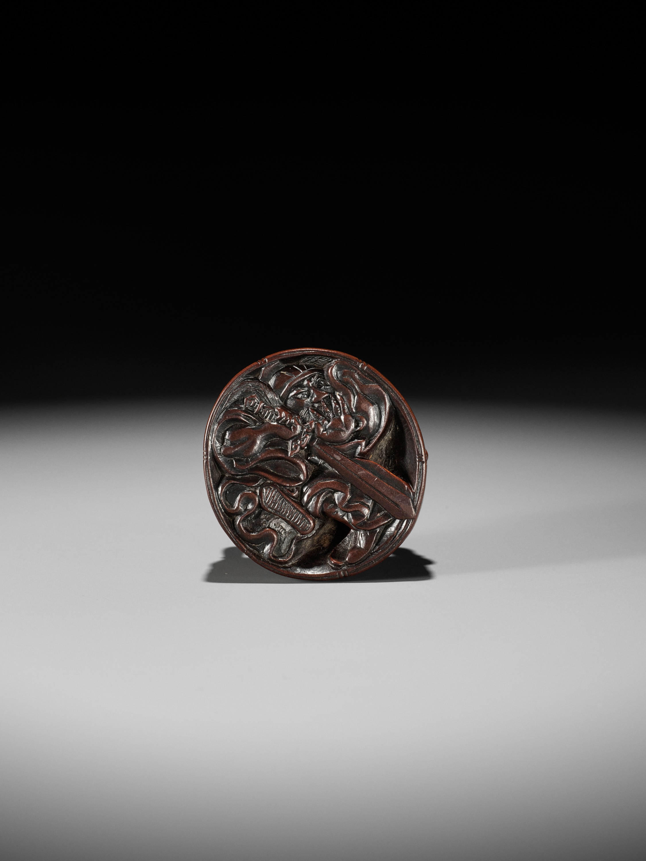 Lot 65 - MASANAO: A RARE WOOD NETSUKE OF AN ONI