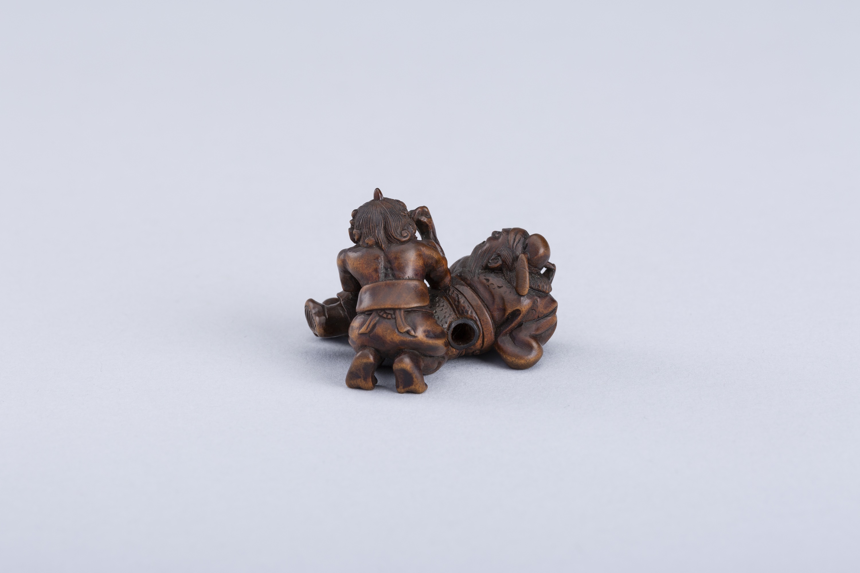 Lot 888 - KOGYOKU: A WOOD NETSUKE OF SHOKI AND ONI,