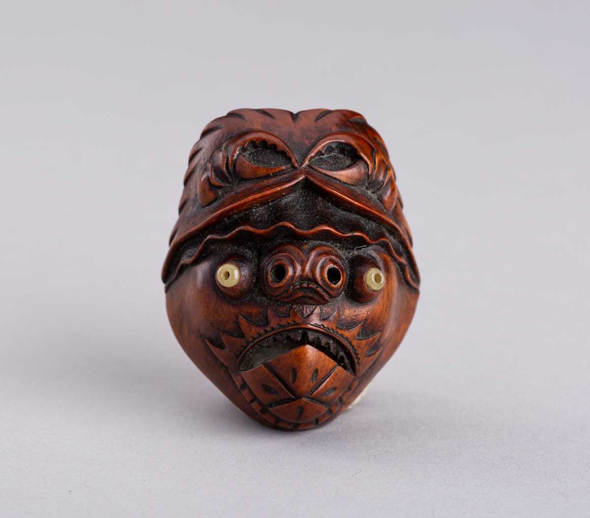 Lot 826 - MITSUAKI: A RARE WOOD NETSUKE OF A BAKEMONO