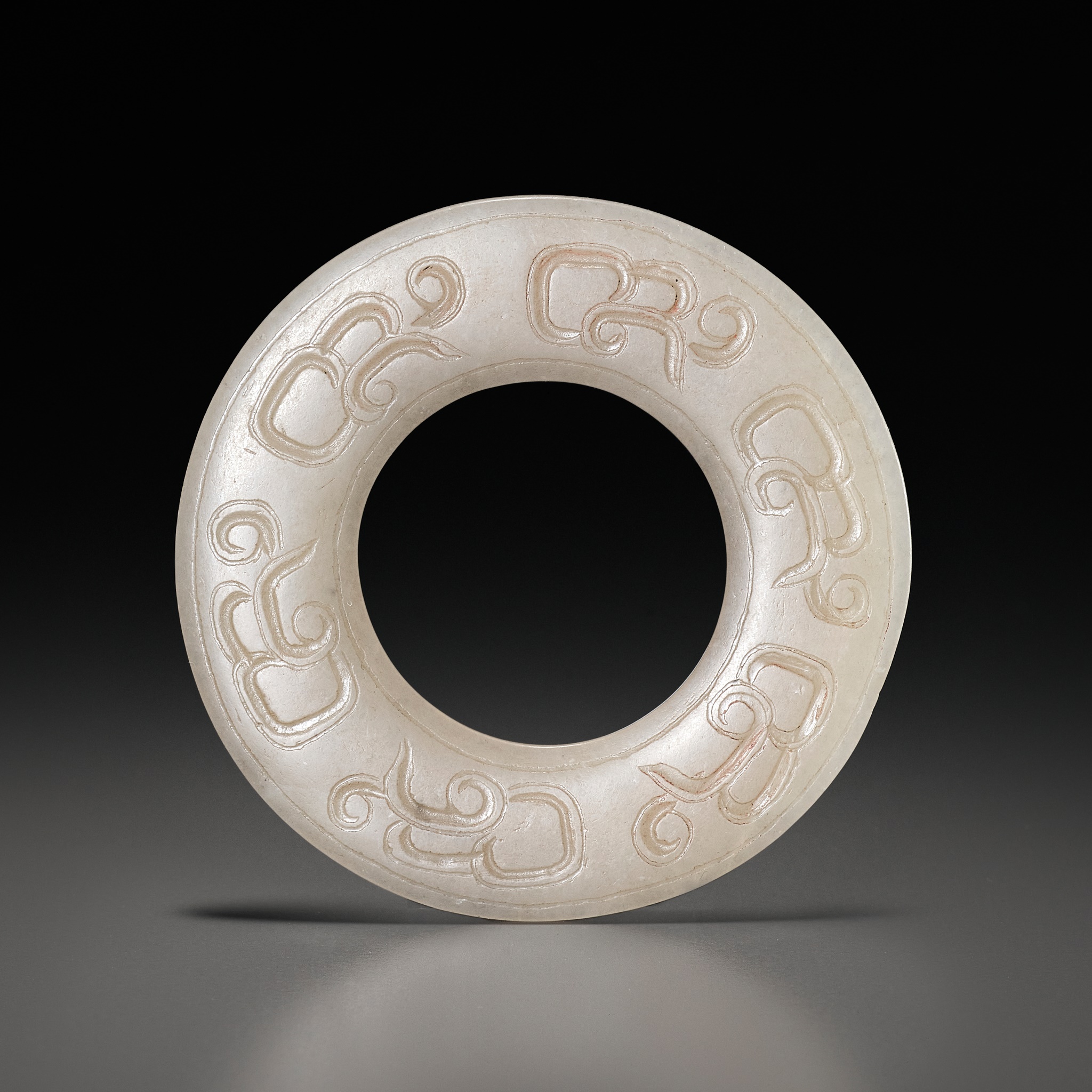 Lot 64 - A JADE RING, HUAN, EASTERN ZHOU DYNASTY