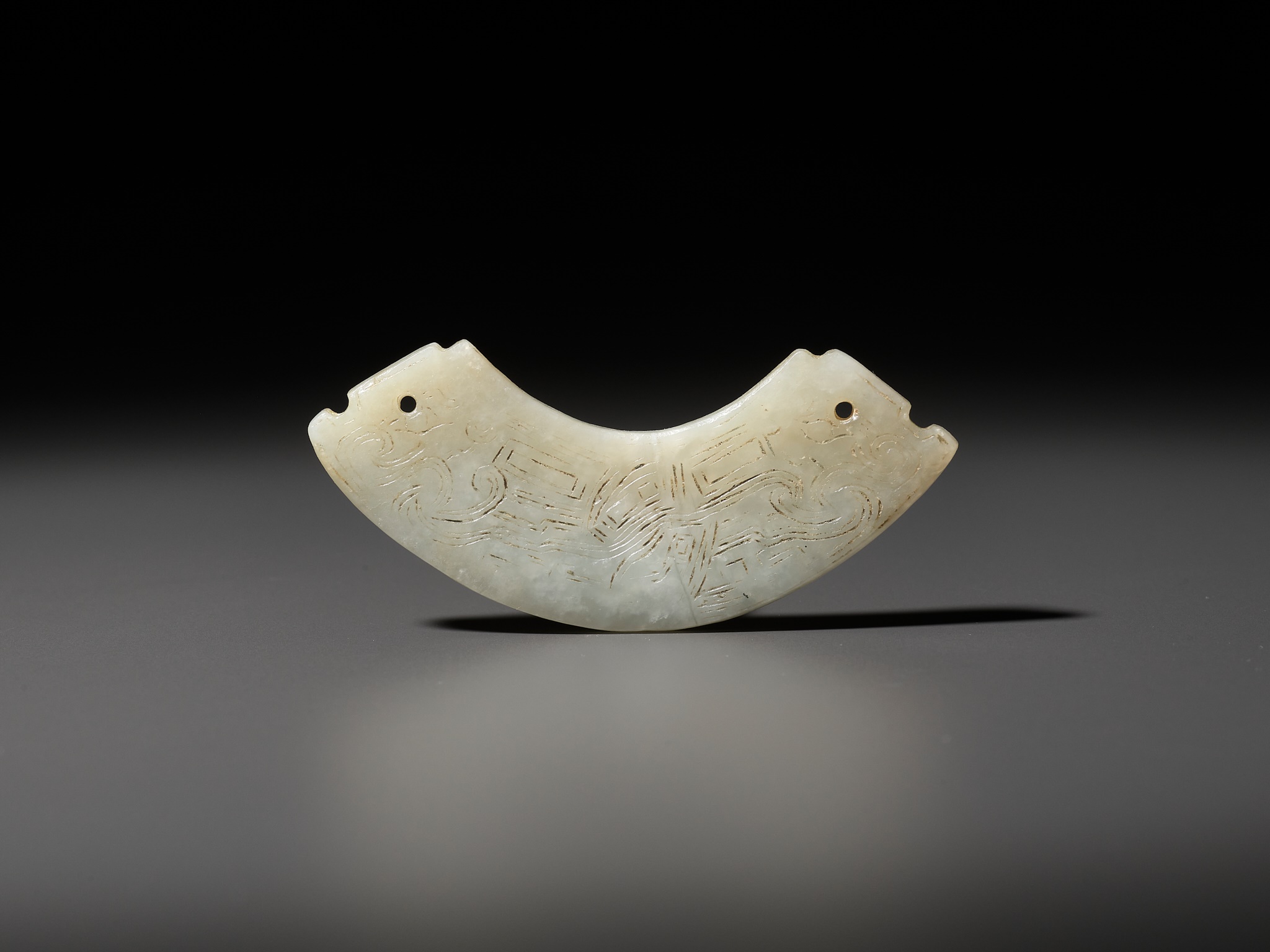 Lot 59 - A JADE ‘DRAGON’ PENDANT, HUANG, WESTERN ZHOU