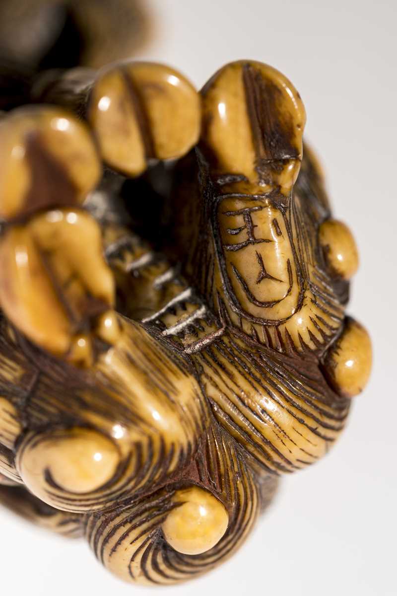 Lot 31 - GYOKUZAN: AN IVORY NETSUKE OF A KIRIN