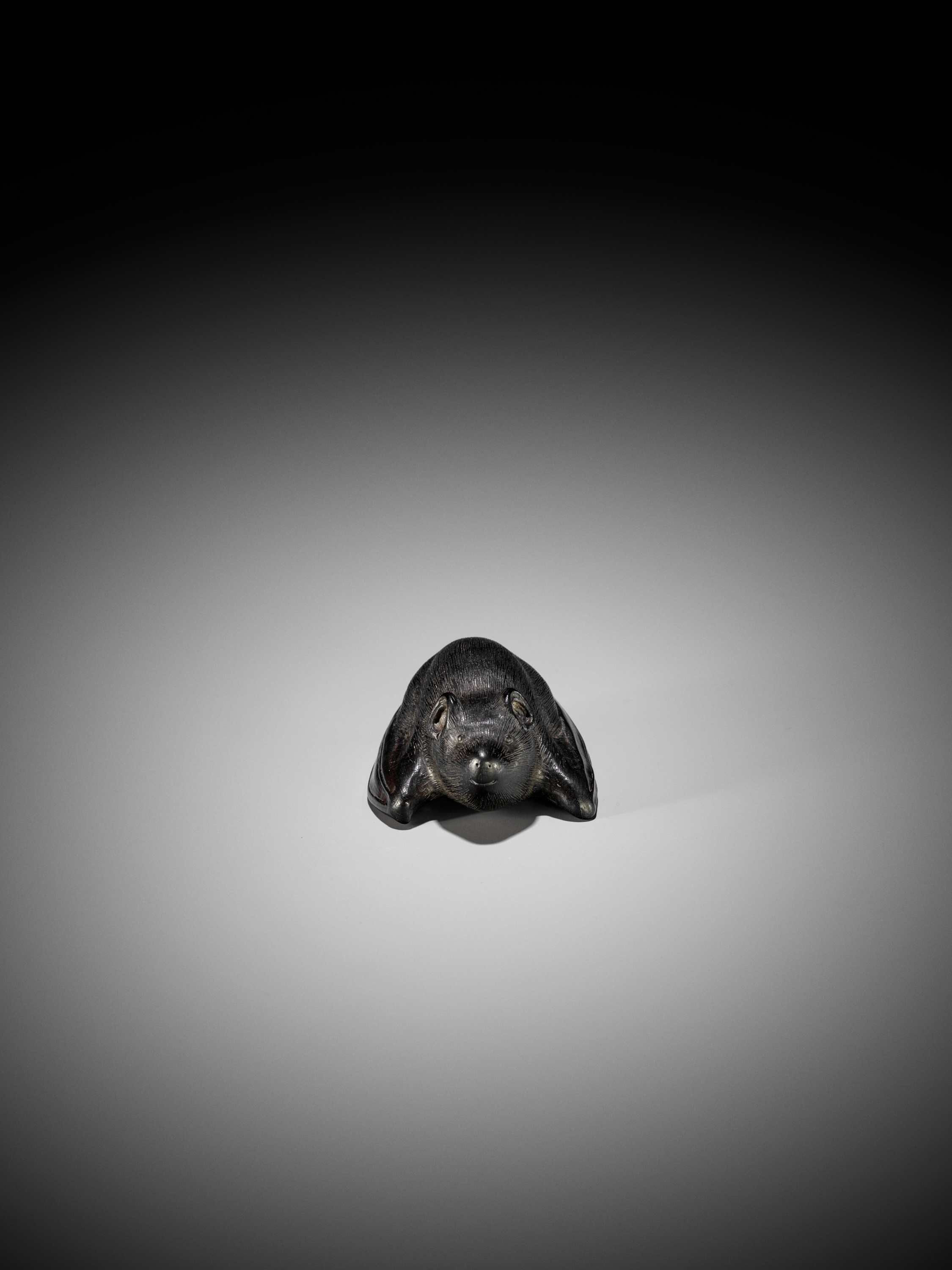 Lot 735 - A RARE EBONY WOOD NETSUKE OF A BAT, EDO