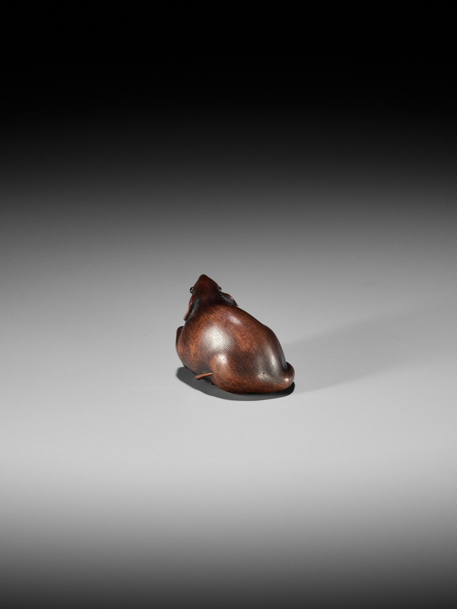 Lot 86 - IKKAN: A FINE WOOD NETSUKE OF A RAT WITH A