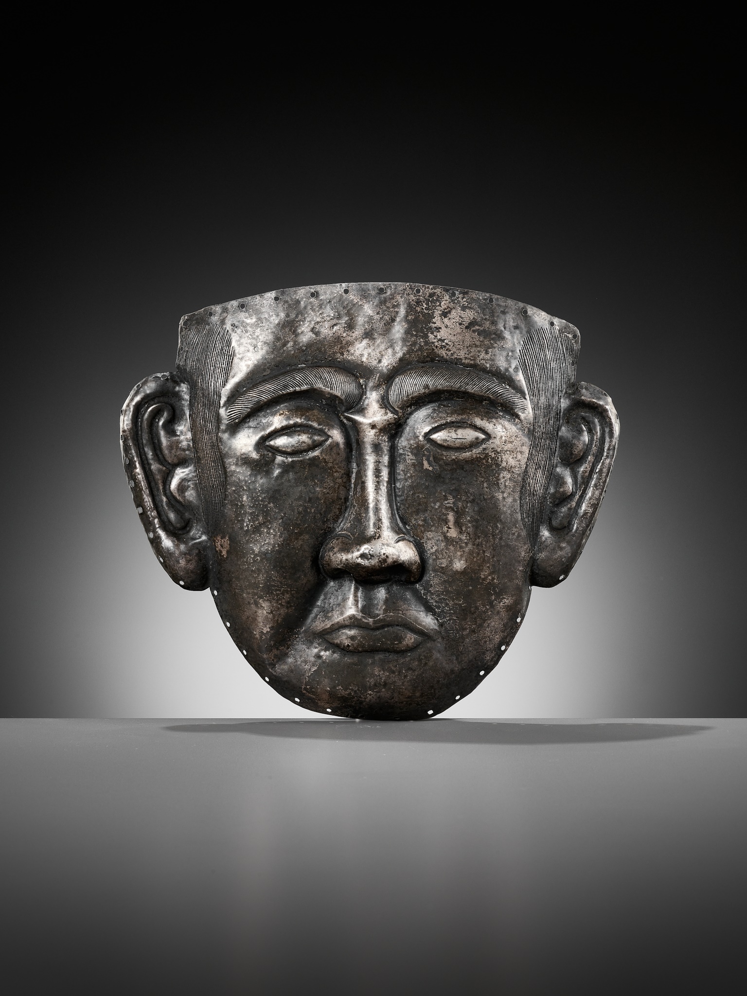 Lot 107 - A SILVER FUNERARY MASK OF A NOBLEMAN, LIAO