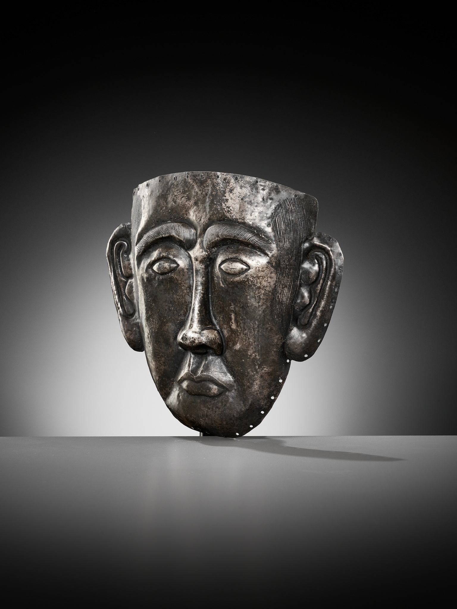 Lot 107 - A SILVER FUNERARY MASK OF A NOBLEMAN, LIAO