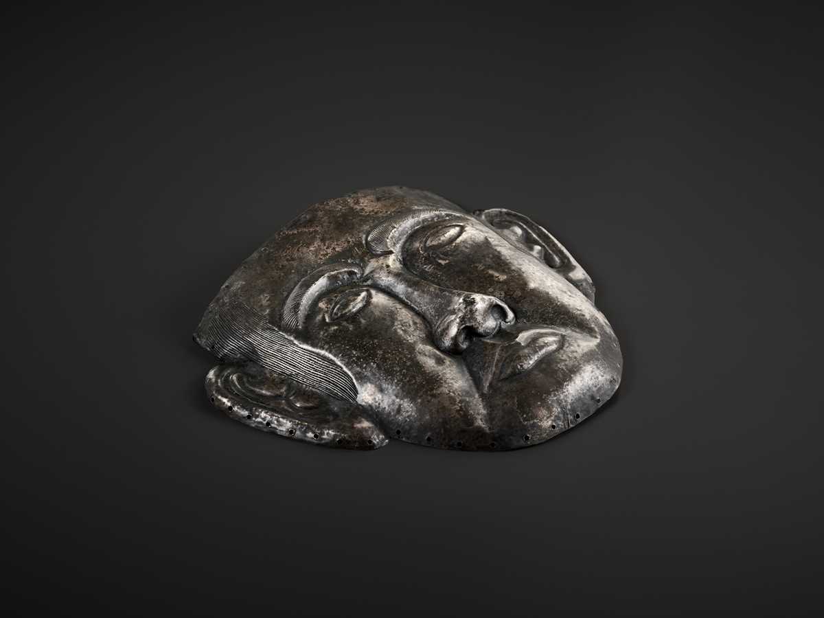 Lot 107 - A SILVER FUNERARY MASK OF A NOBLEMAN, LIAO