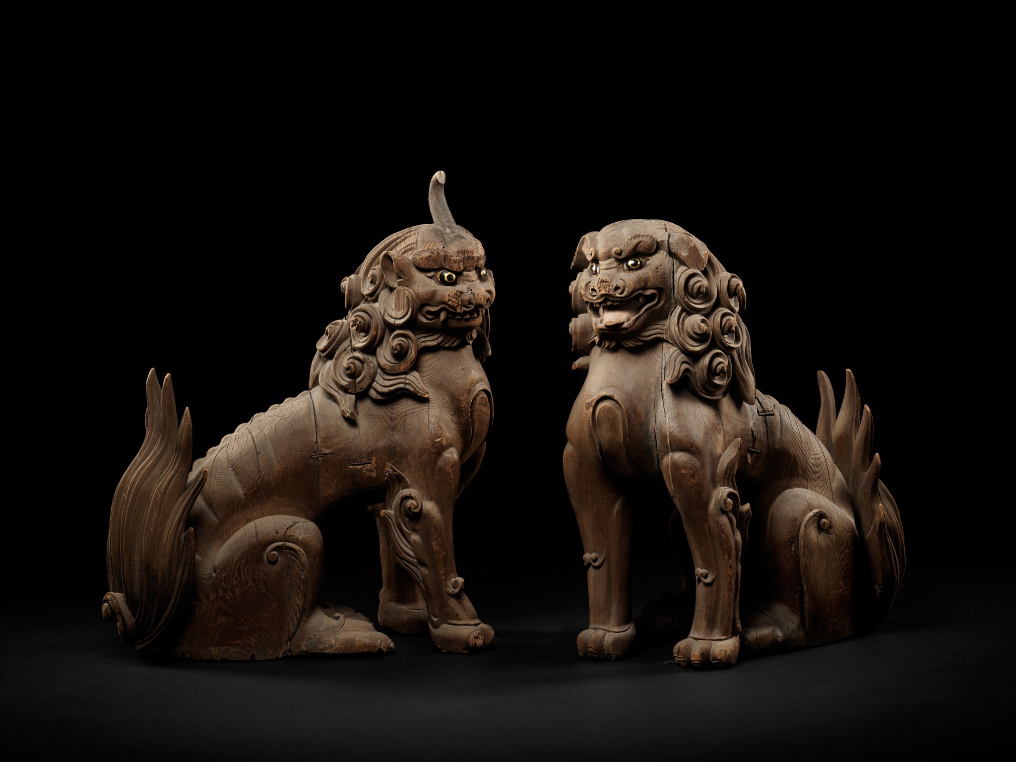Lot 46 - A PAIR OF WOOD KOMAINU (KOREAN GUARDIAN DOGS),