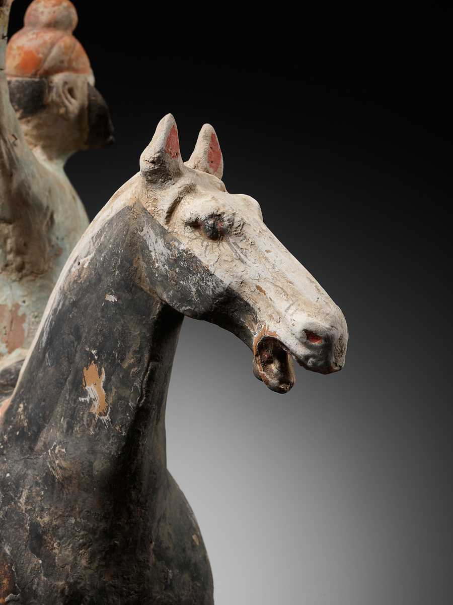 Lot 149 - A RARE PAINTED POTTERY HORSE WITH A