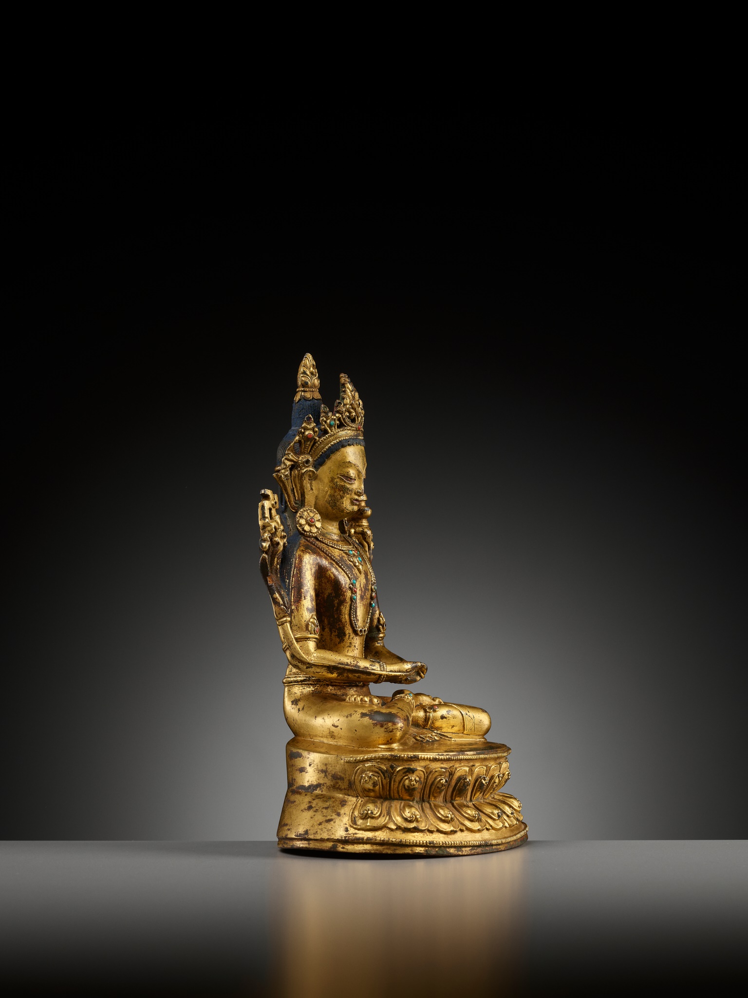 Lot 10 - A GILT BRONZE FIGURE OF TONPA SHENRAP