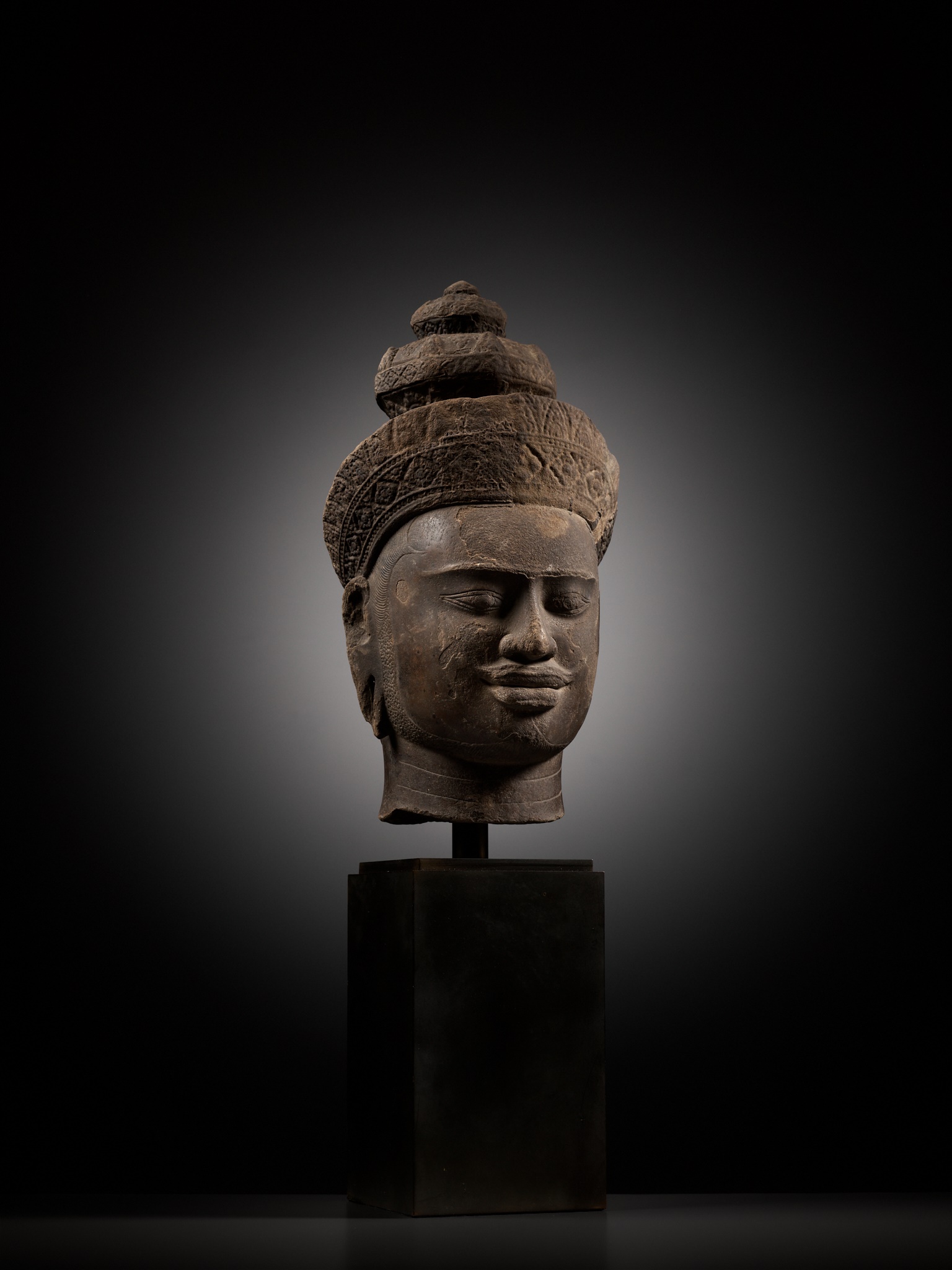 Lot 265 - A LARGE SANDSTONE HEAD OF VISHNU, ANGKOR