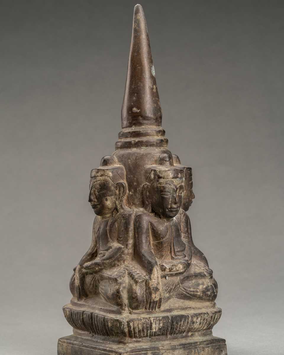 Lot 1573 - A HEAVY BRONZE STUPA WITH FOUR CARDINAL