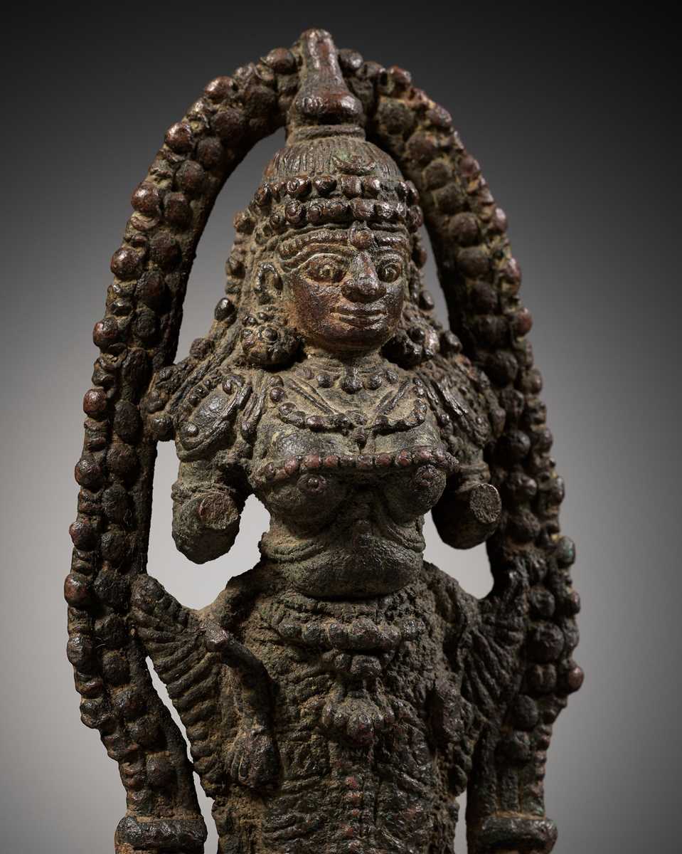 Lot 728 - AN ELABORATE KERALA BRONZE FIGURE OF A