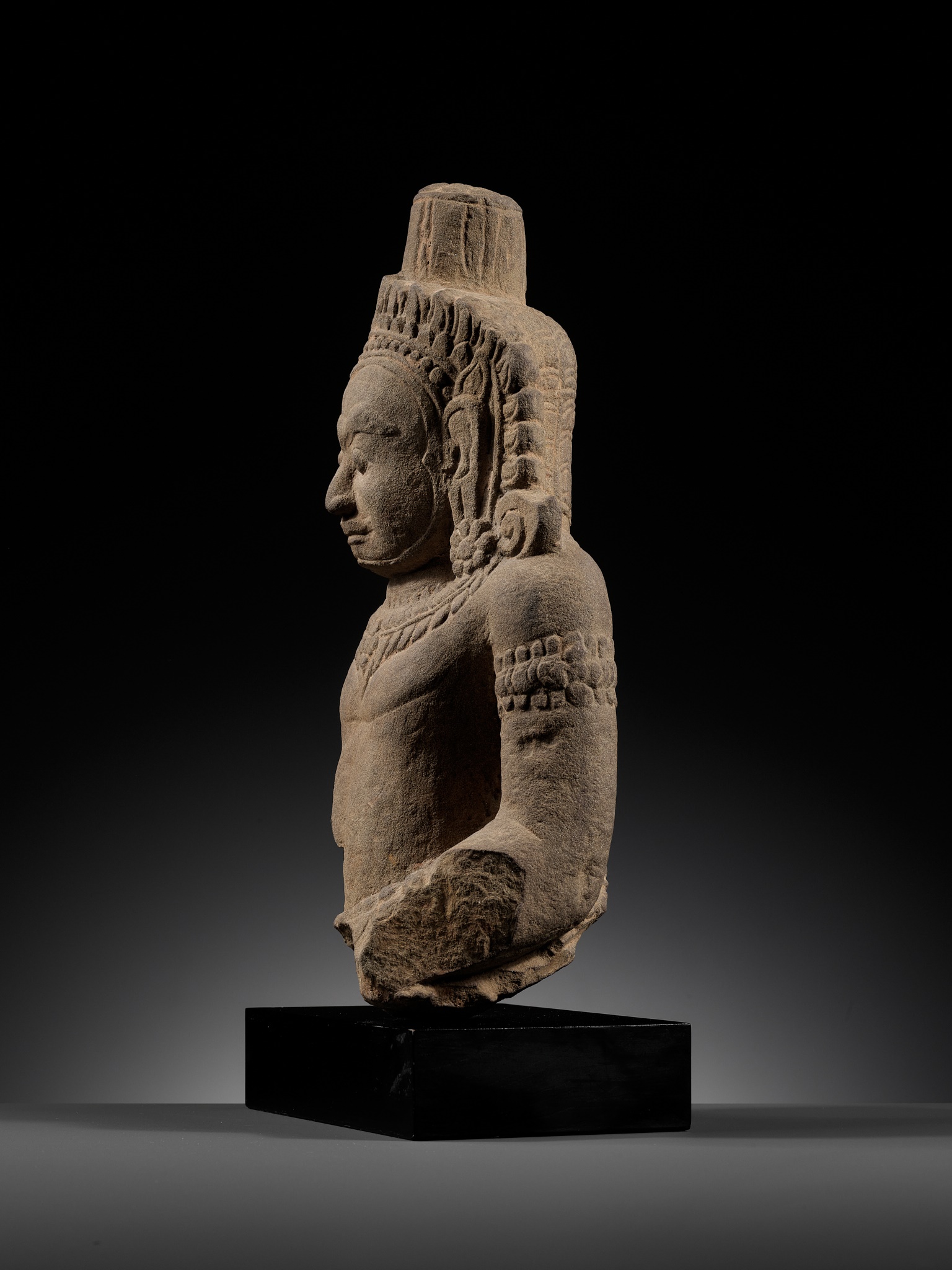 Lot 709 - A SANDSTONE BUST OF A DEMON, ASURA, ANGKOR