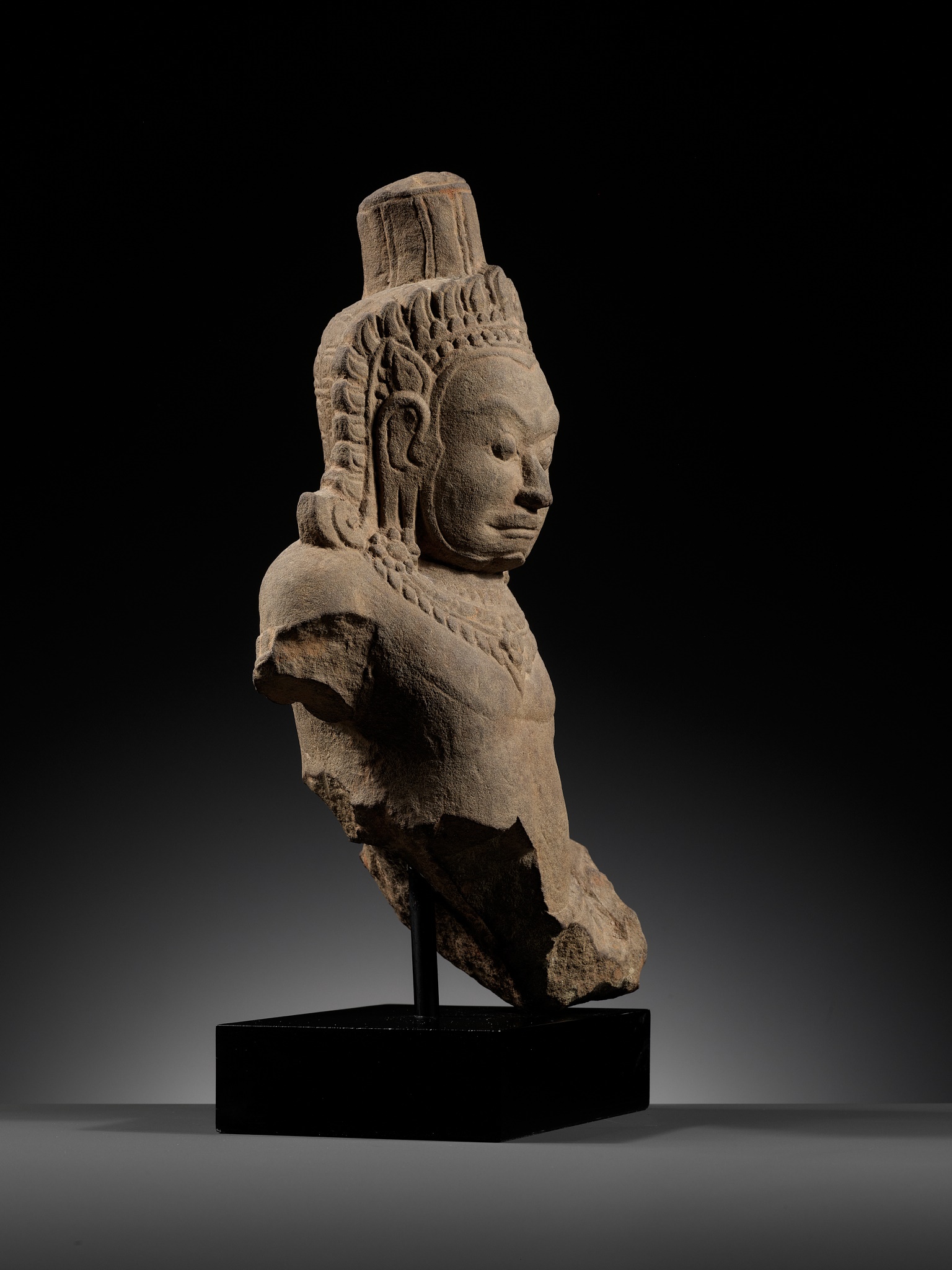 Lot 709 - A SANDSTONE BUST OF A DEMON, ASURA, ANGKOR