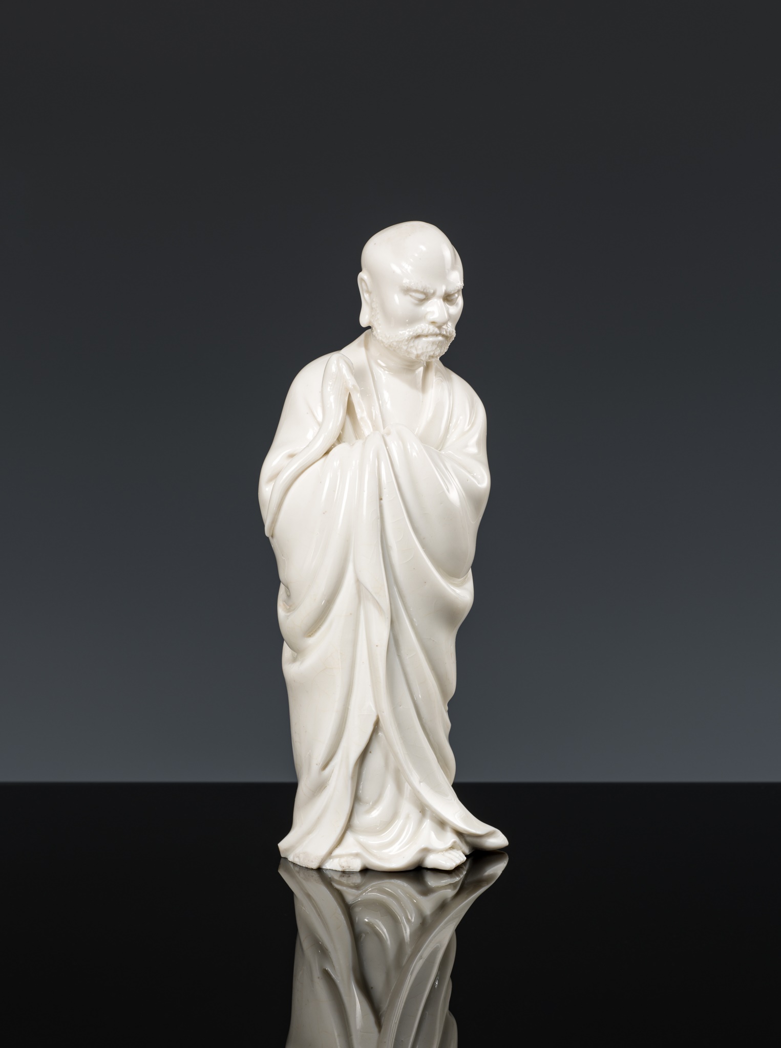 Lot 81 - A DEHUA FIGURE OF DAMO (BODHIDHARMA), CHINA,