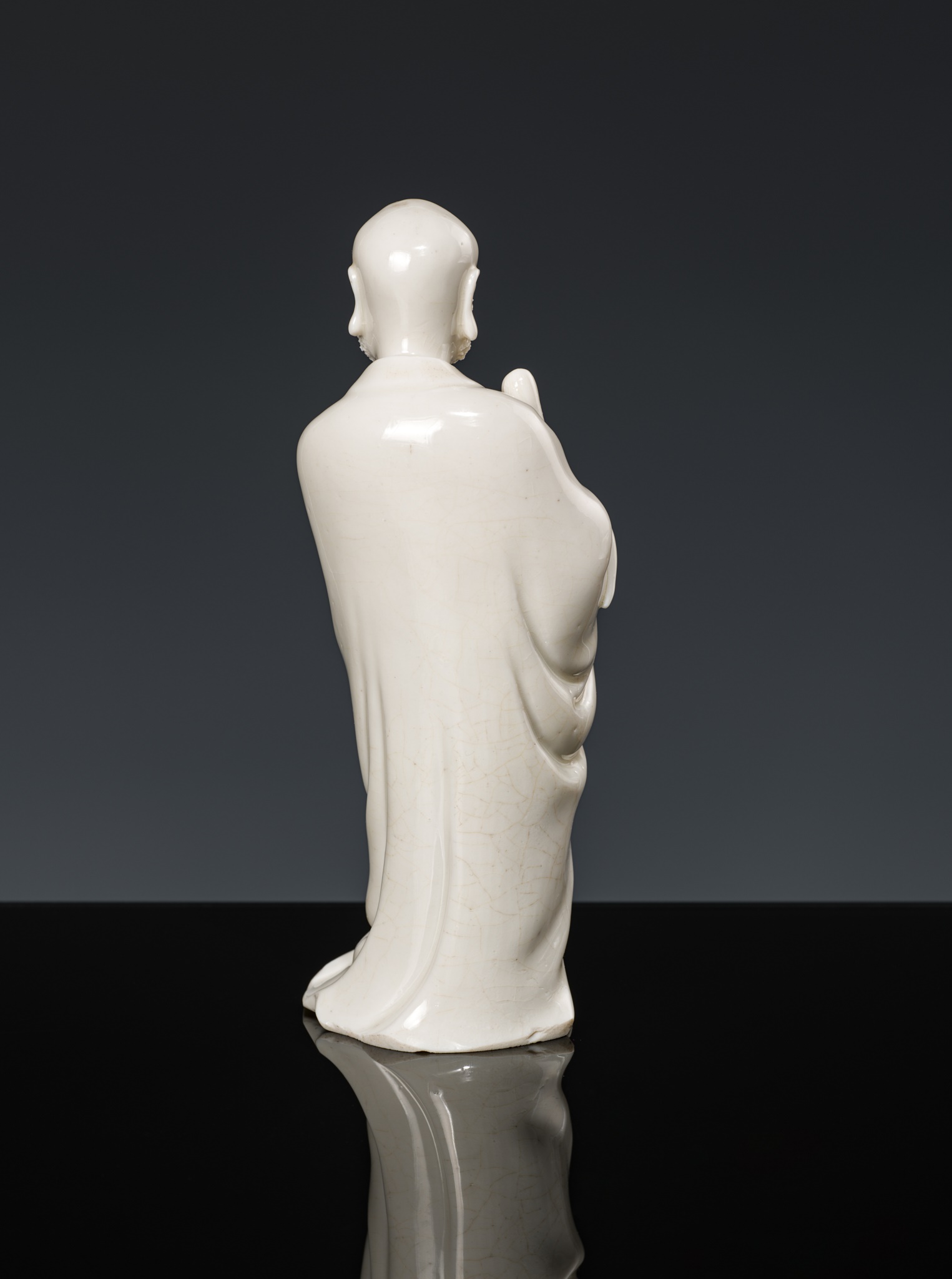Lot 81 - A DEHUA FIGURE OF DAMO (BODHIDHARMA), CHINA,