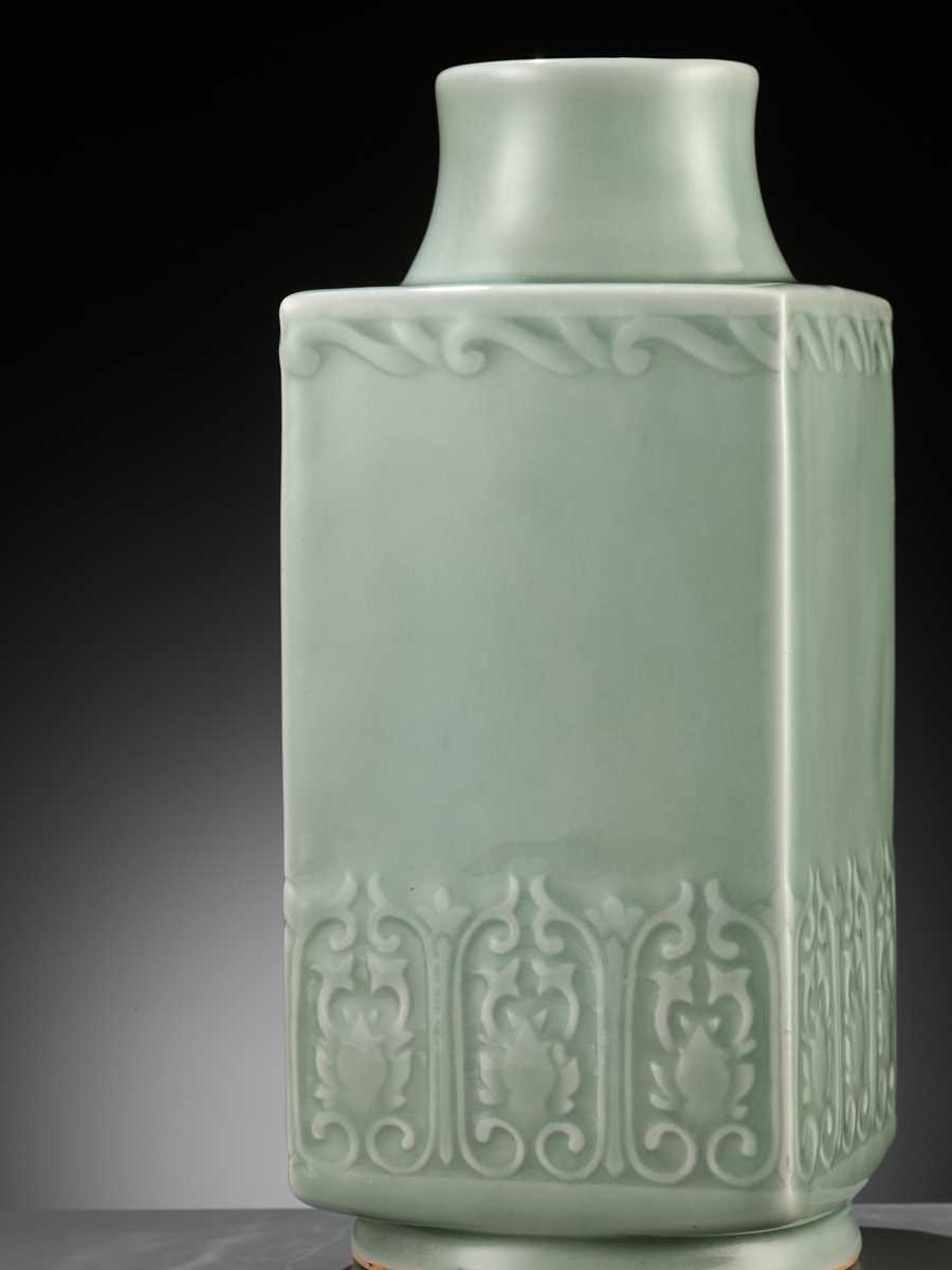 Lot 500 - A CARVED AND CELADON-GLAZED CONG-FORM VASE,