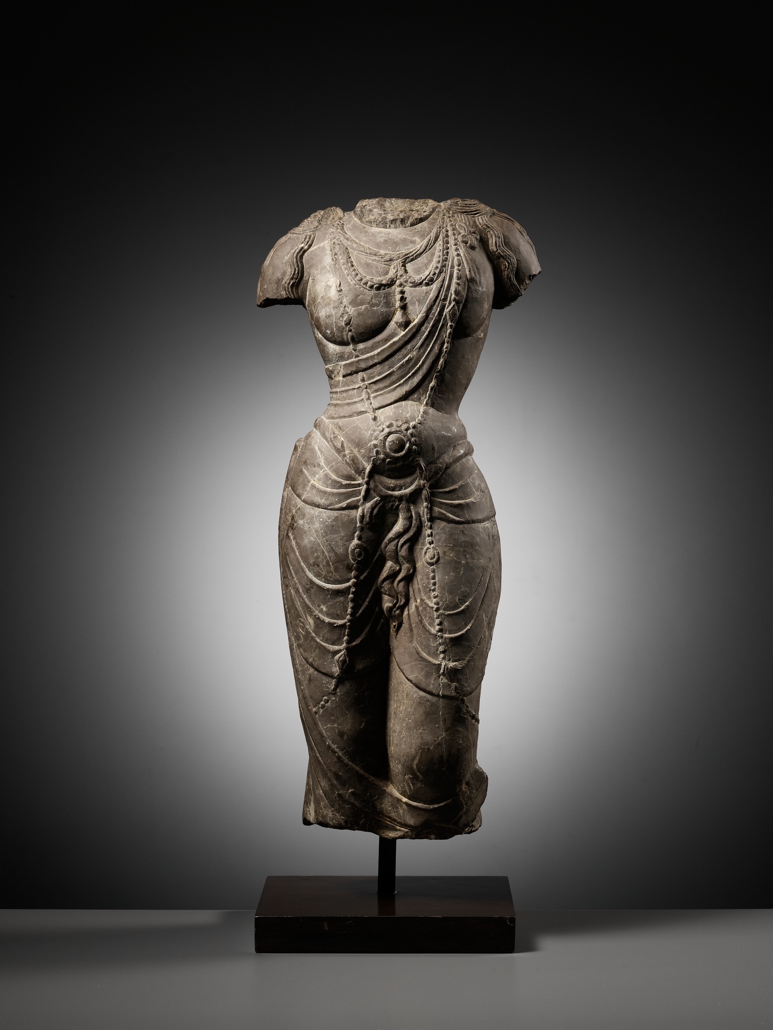 Lot 171 - A LIMESTONE TORSO OF A BODHISATTVA, TANG