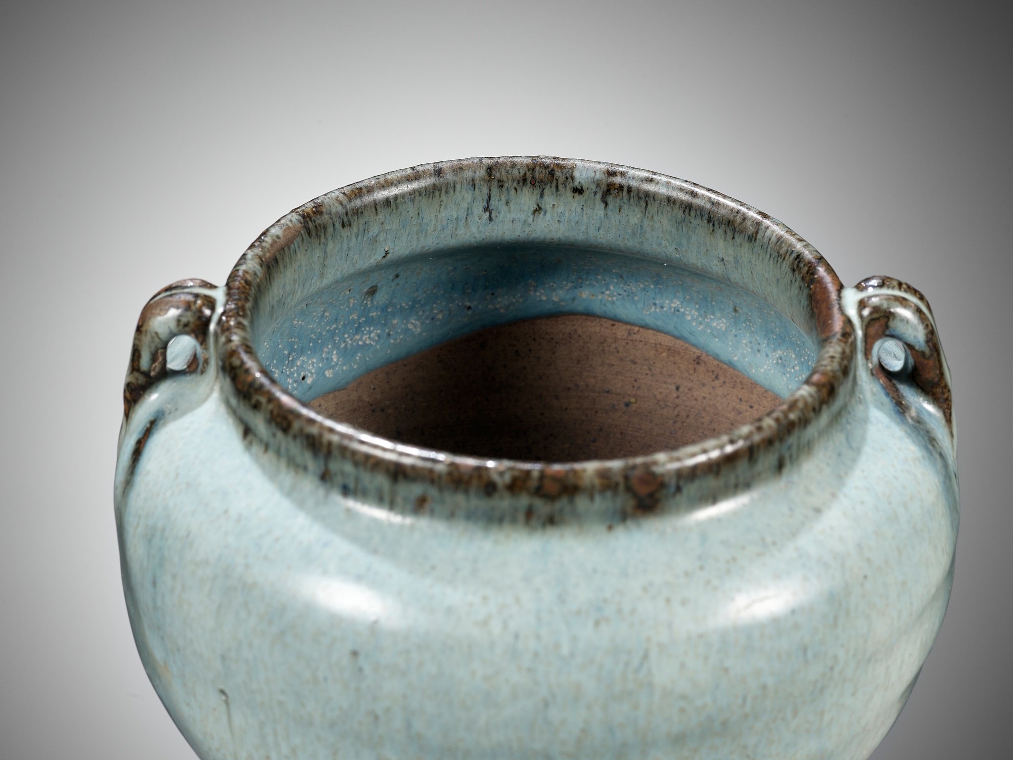 Lot 456 - A JUN-GLAZED TWIN-HANDLED JAR, JIN DYNASTY