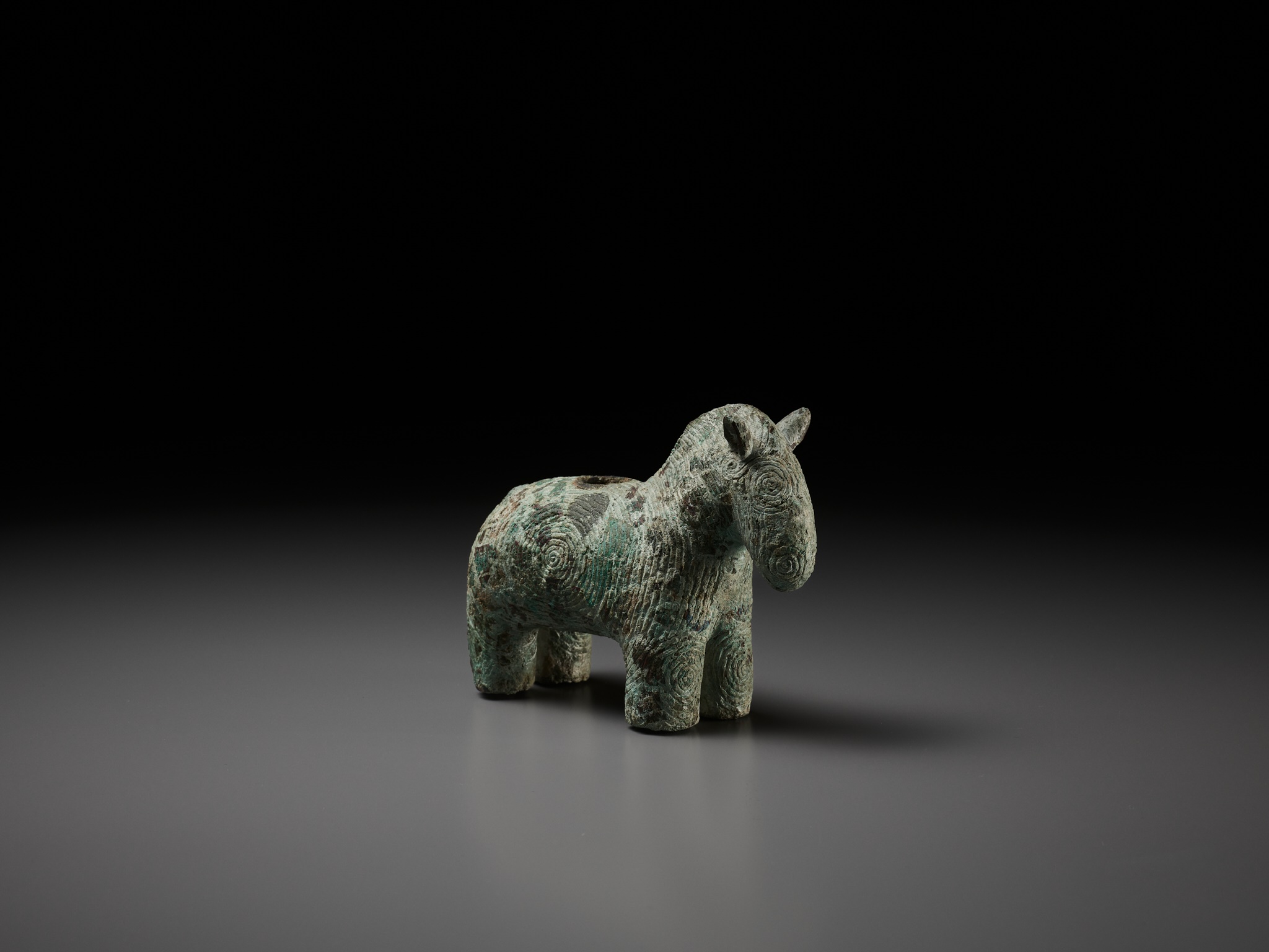 Lot 299 - A RARE BRONZE HORSE-FORM VESSEL, DONG SON