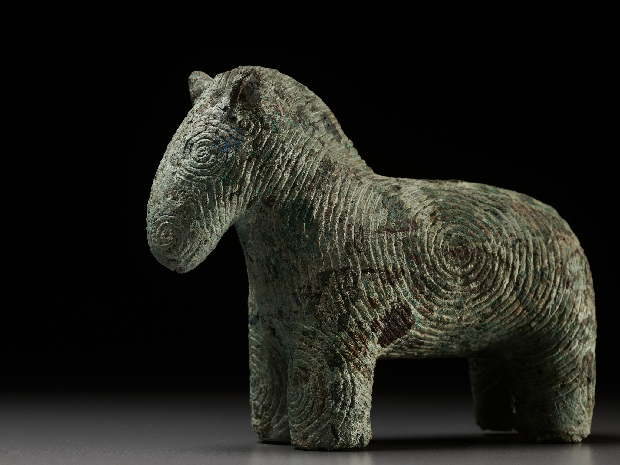 Lot 299 - A RARE BRONZE HORSE-FORM VESSEL, DONG SON