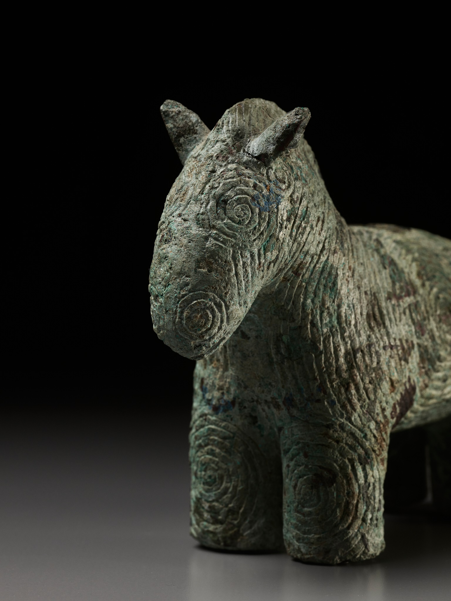 Lot 299 - A RARE BRONZE HORSE-FORM VESSEL, DONG SON