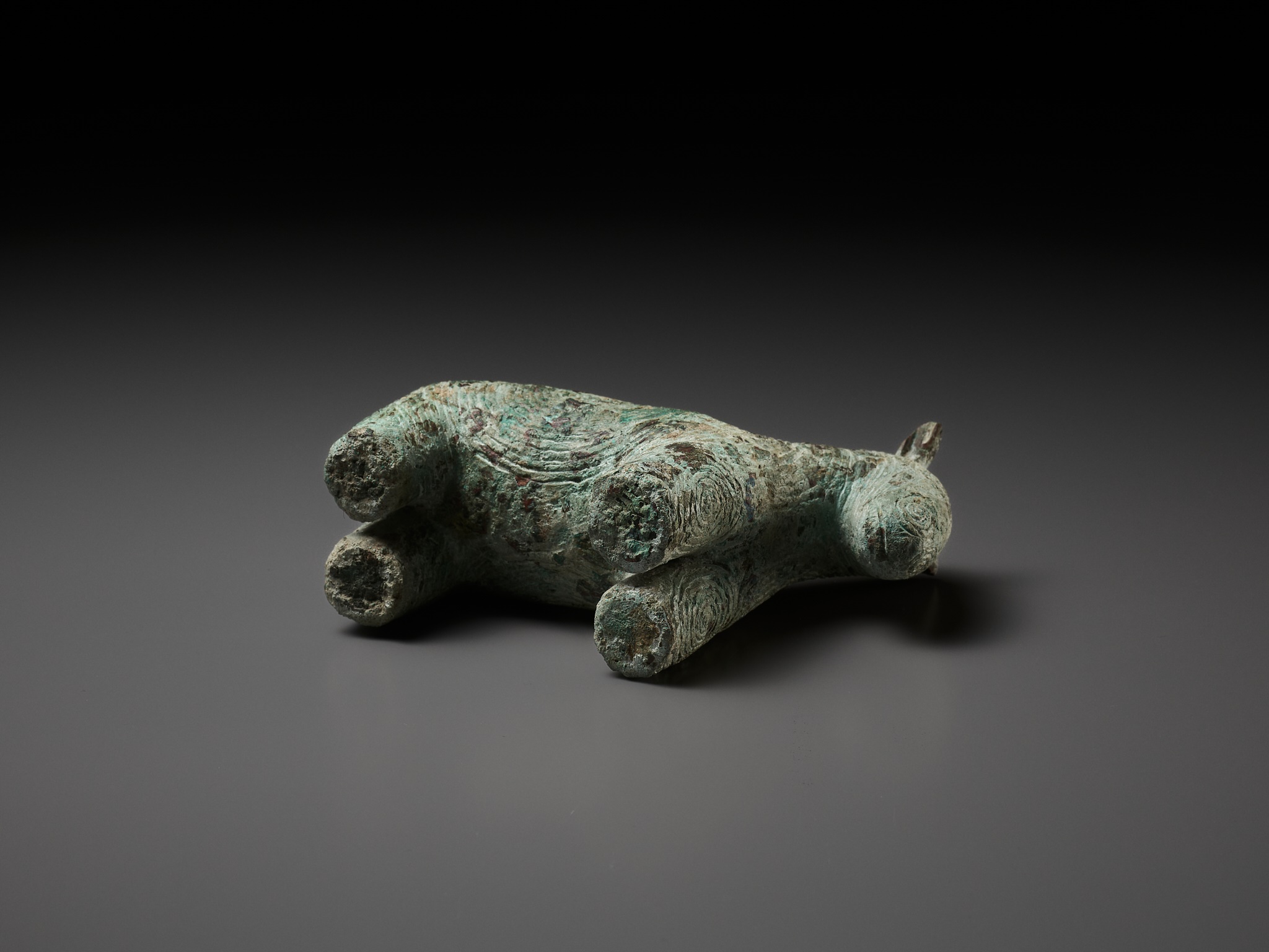 Lot 299 - A RARE BRONZE HORSE-FORM VESSEL, DONG SON