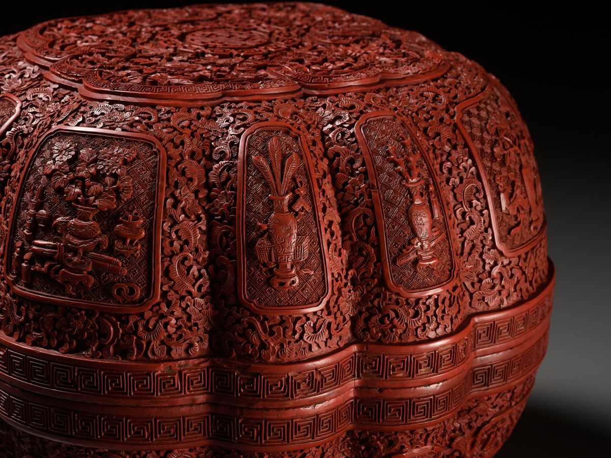 Lot 87 - AN IMPERIAL CINNABAR LACQUER LOBED BOX AND