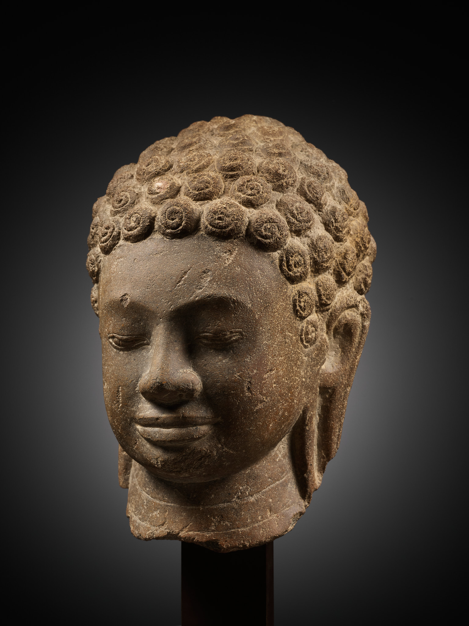 Lot 166 - A STONE HEAD OF BUDDHA, MON DVARAVATI PERIOD,
